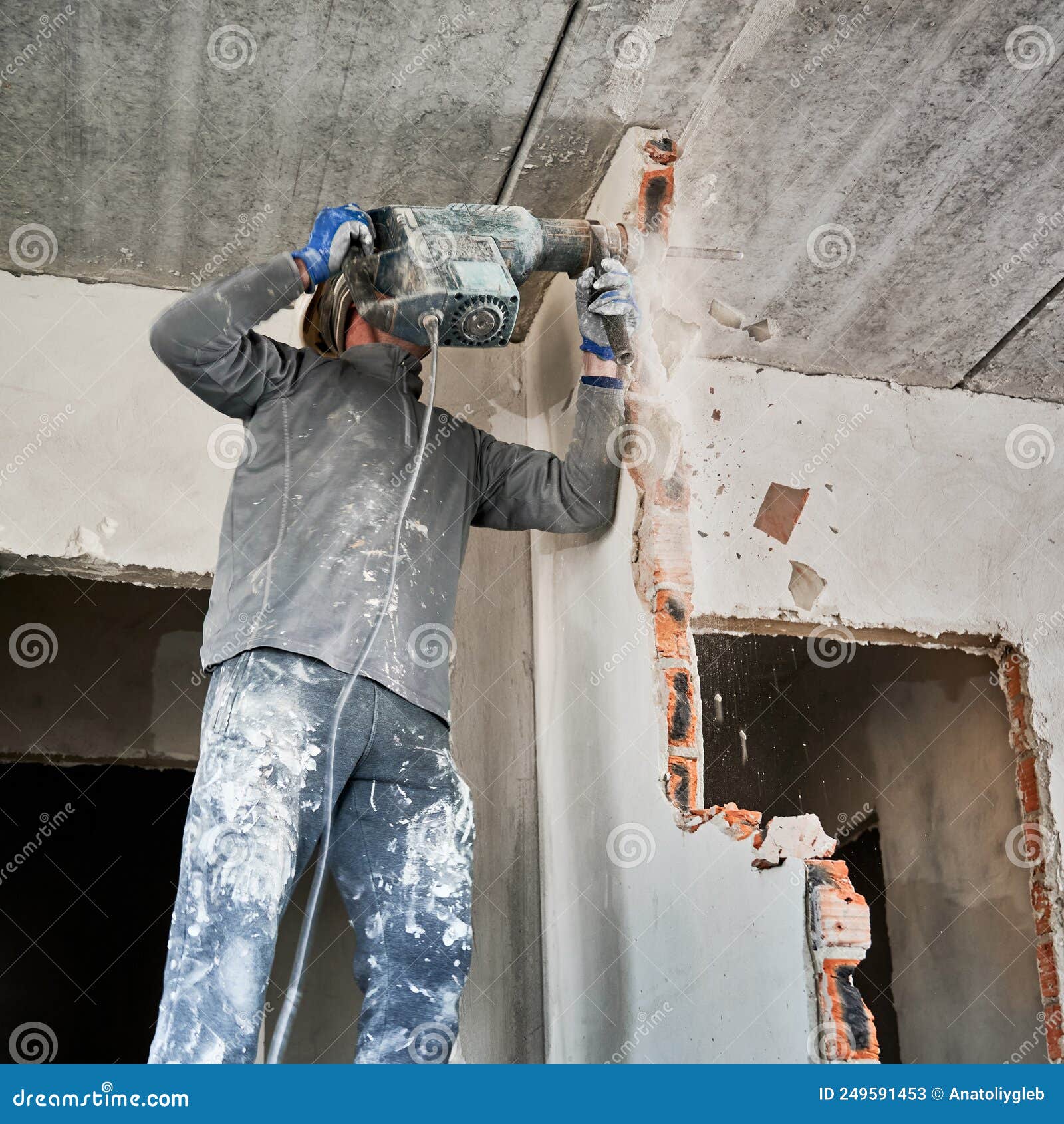 Builder Deconstructing Interior Septum Using Jackhammer in Flat. Stock ...