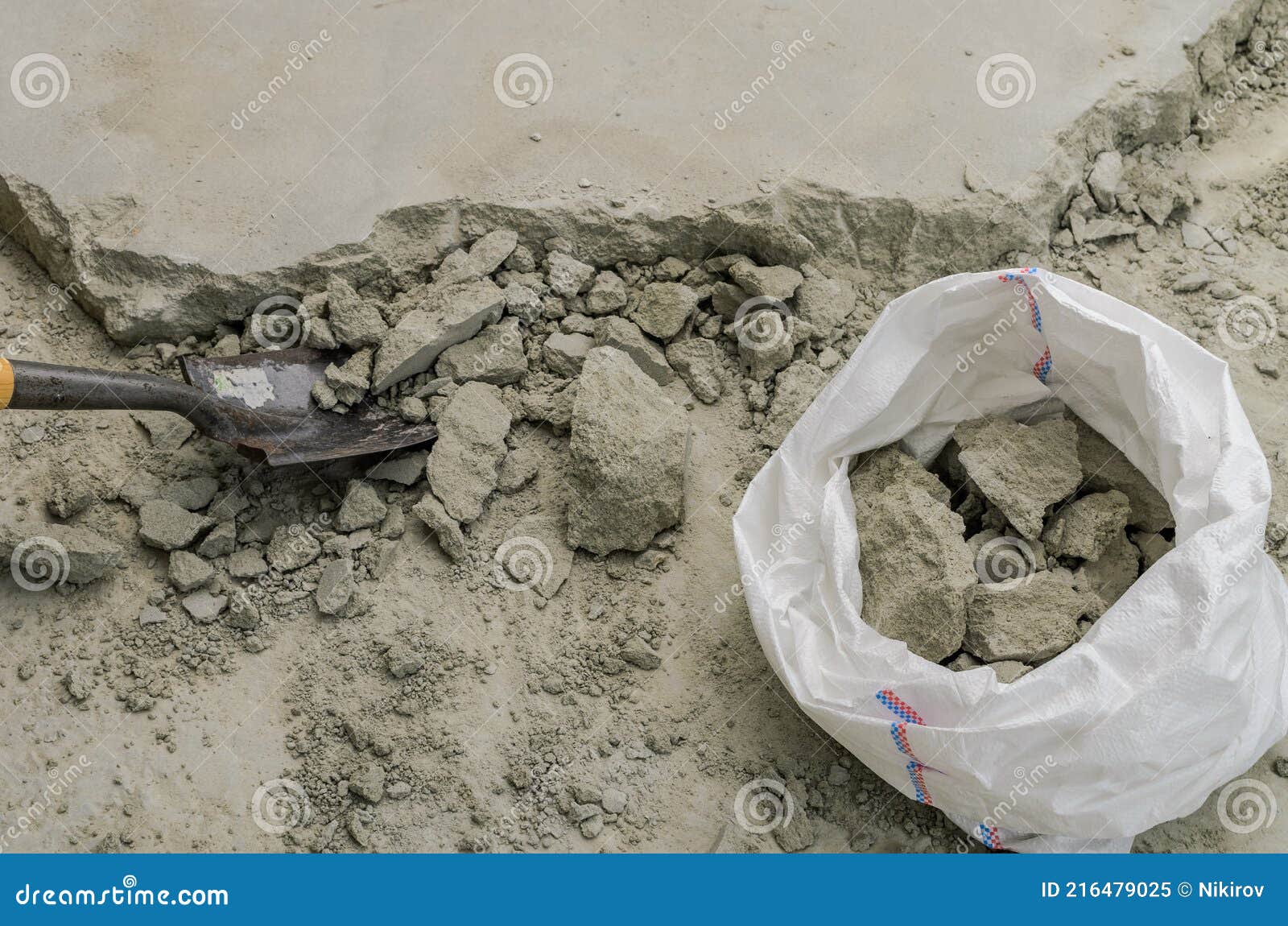 Builder Disassembles Construction Waste with a Shovel into a Bag Stock ...