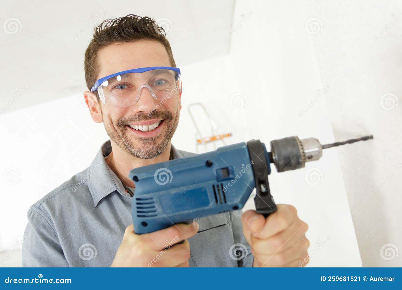 Builder with Drill in Hands Stock Image - Image of workplace, orange ...