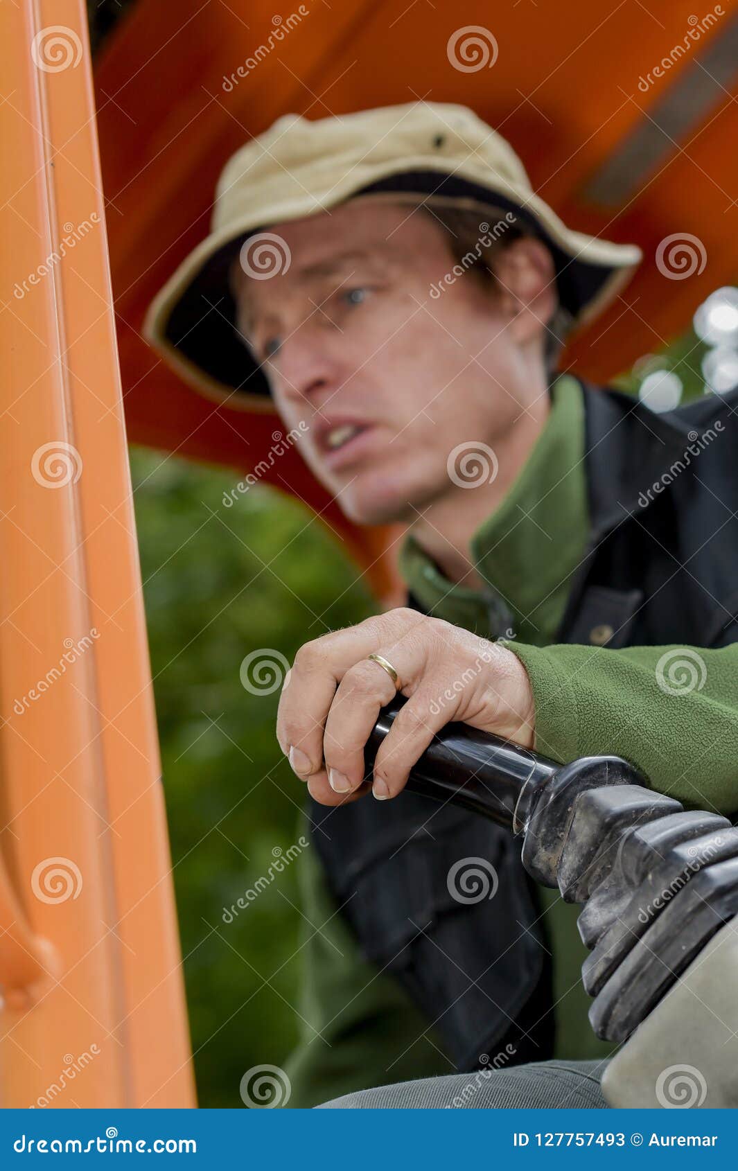 Builder driving a digger stock image. Image of engineering - 127757493
