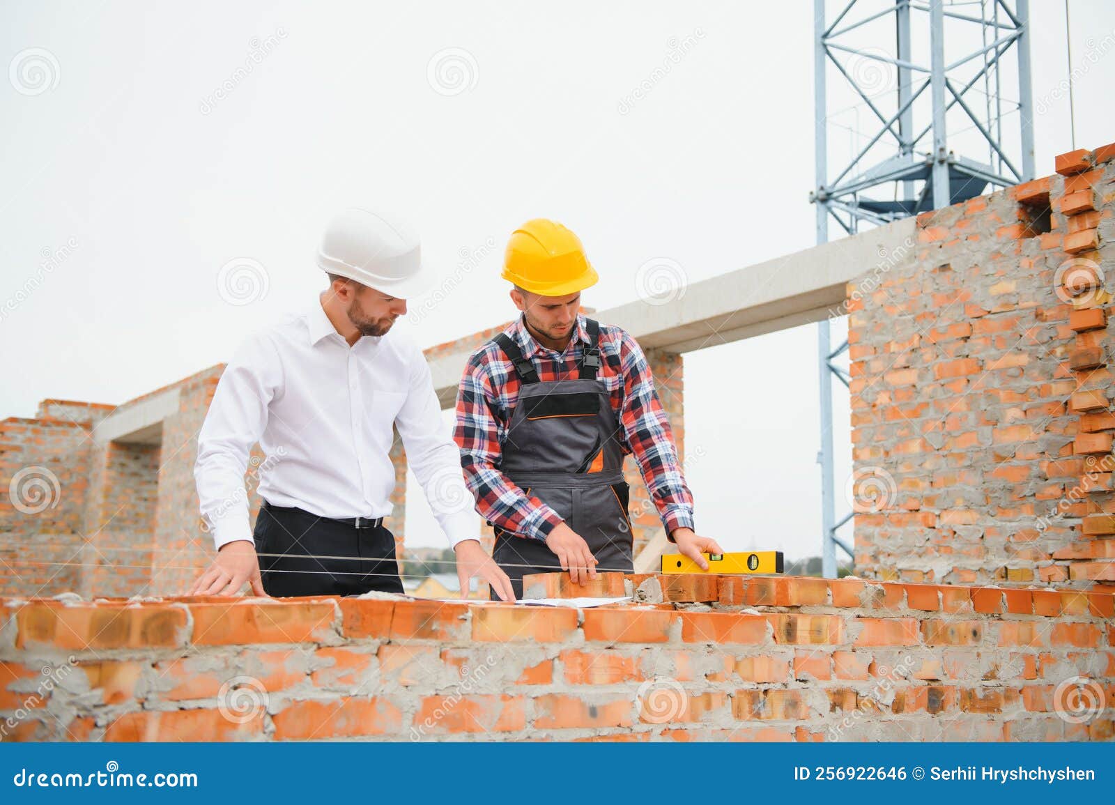 Builder and Engineer on Construction Site Stock Photo - Image of ...