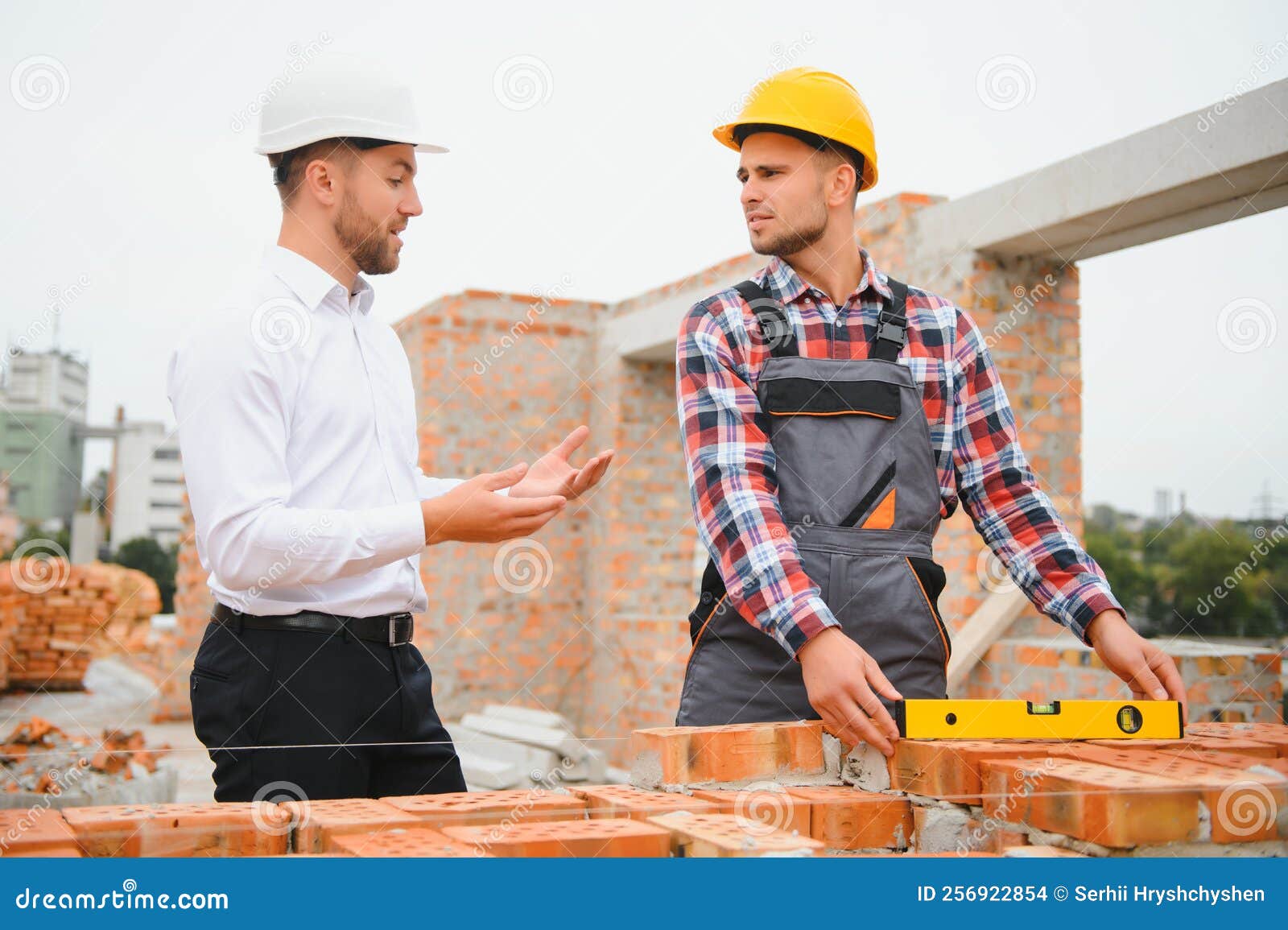 Builder and Engineer on Construction Site Stock Photo - Image of ...