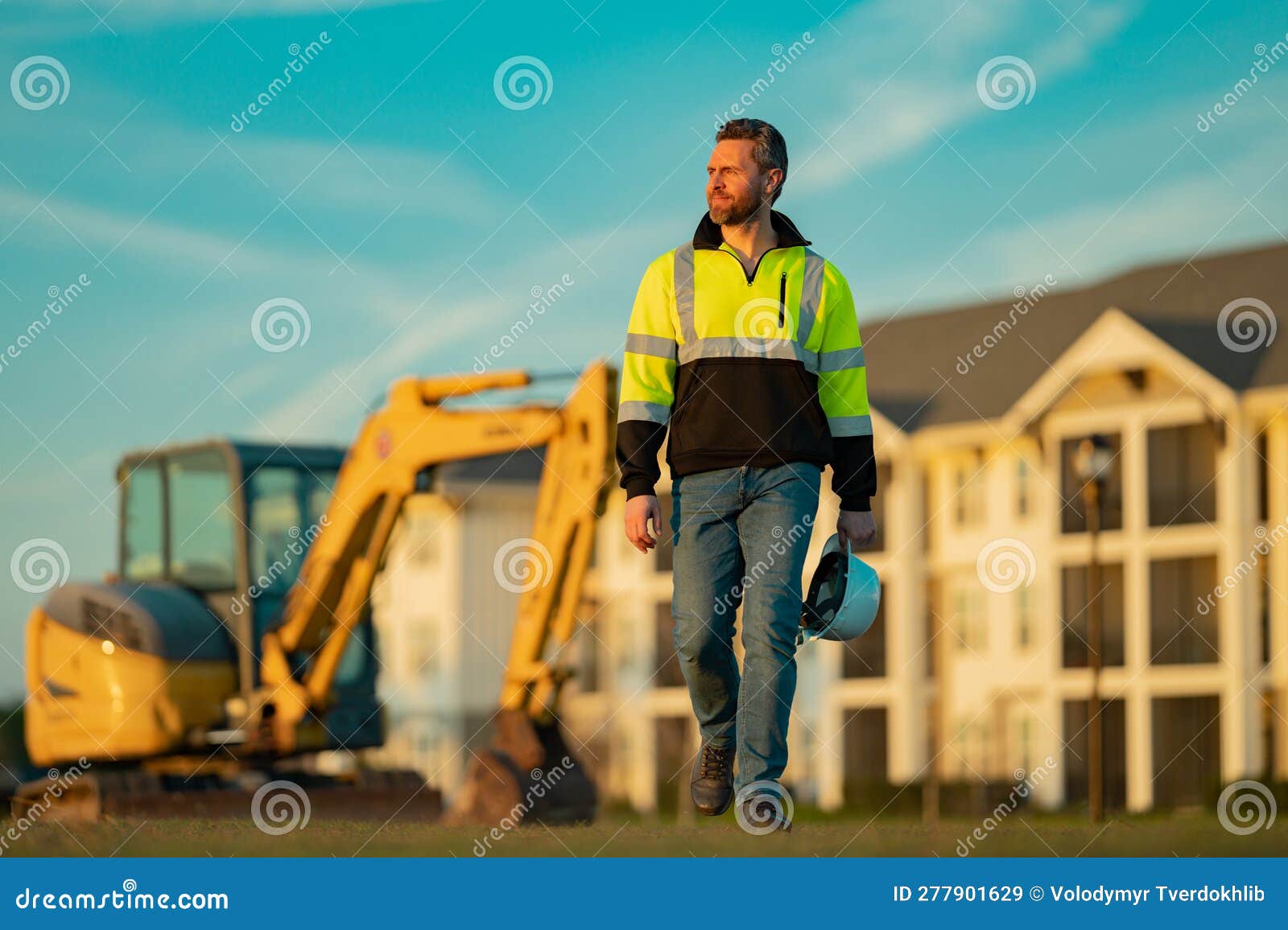 Builder on Excavator. Builder Worker with Excavator. Builder in Helmet ...