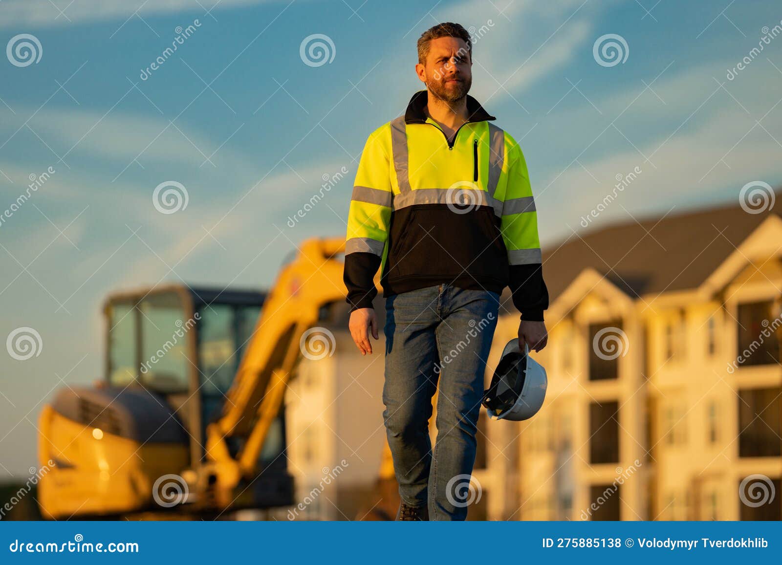 Builder on Excavator. Builder Worker with Excavator. Builder in Helmet ...