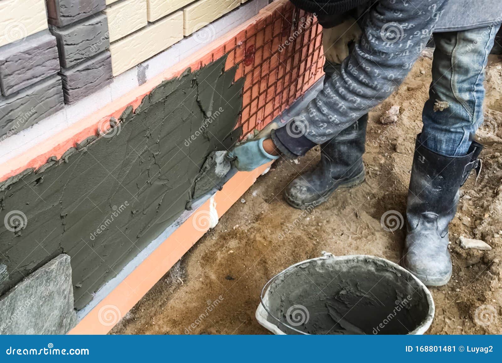 Builder Faces the Basement of a House with a Wild Stone. Flat for ...