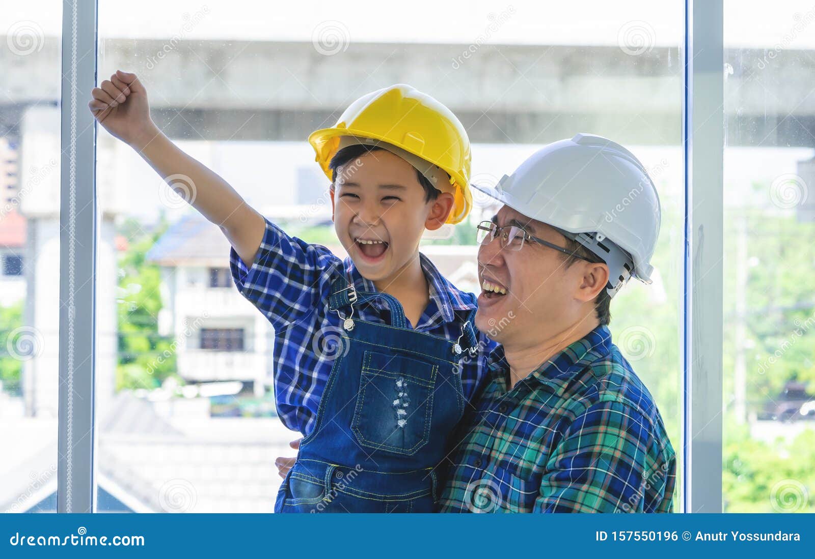 Builder Father Holding Son with Engineering Protecting Hat for Father ...