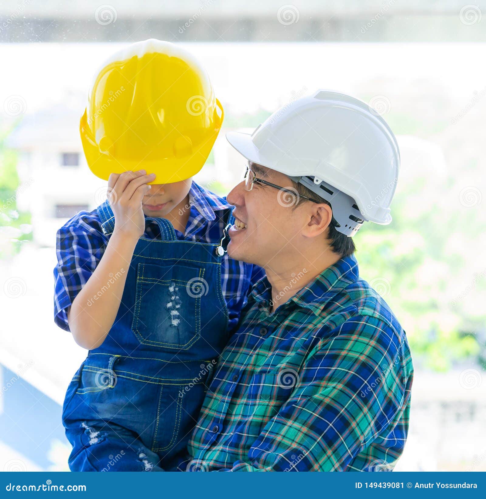 Builder Father Holding Son with Engineering Protecting Hat for Father ...