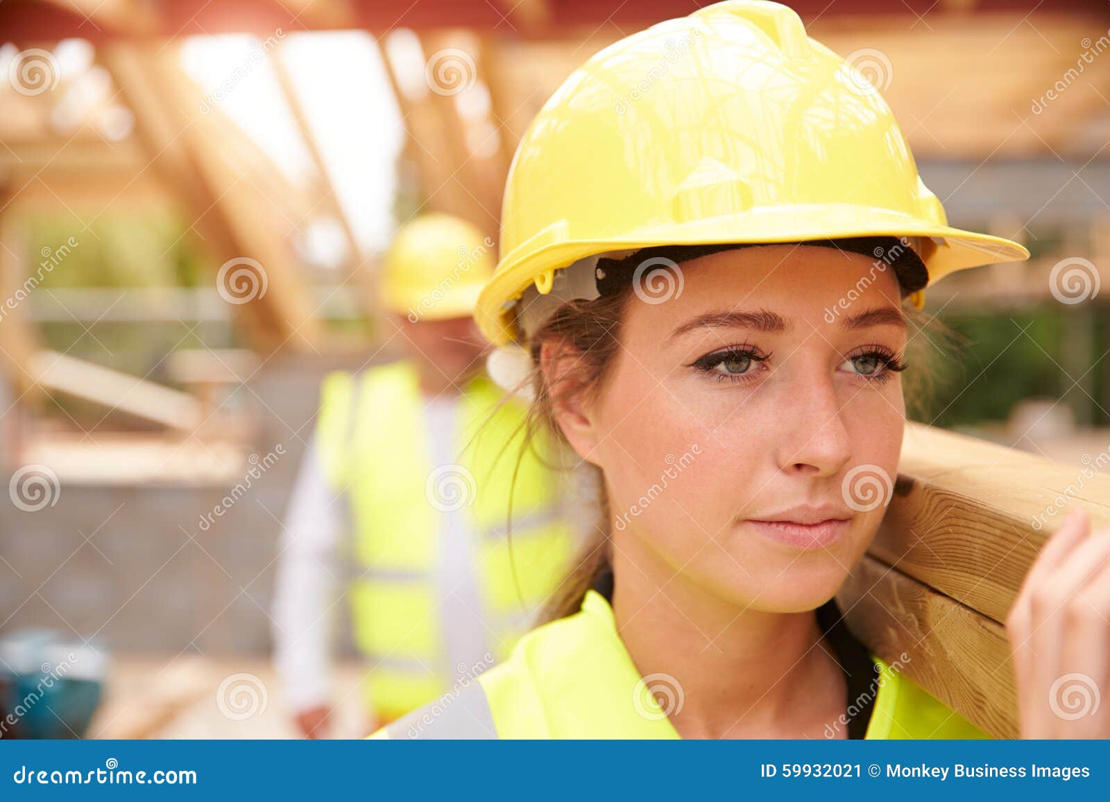 Builder and Female Apprentice Carrying Wood on Site Stock Image - Image ...