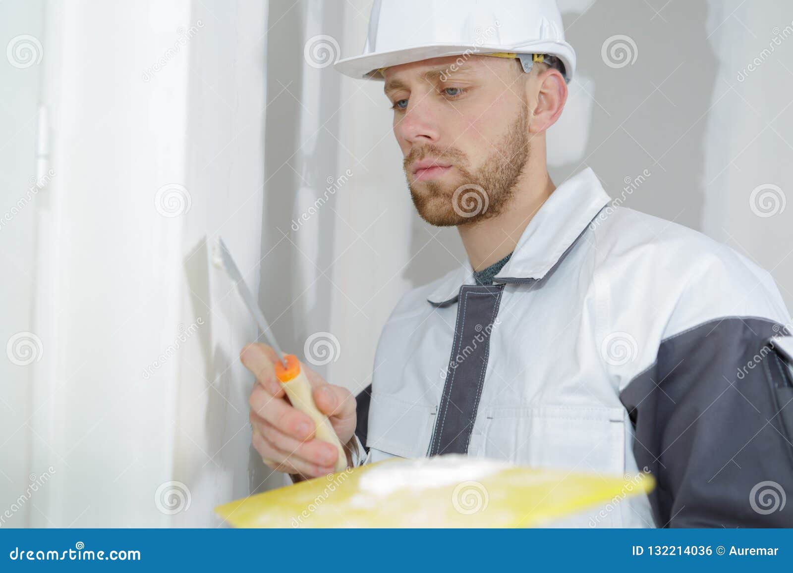 Builder filling the wall stock photo. Image of protect - 132214036