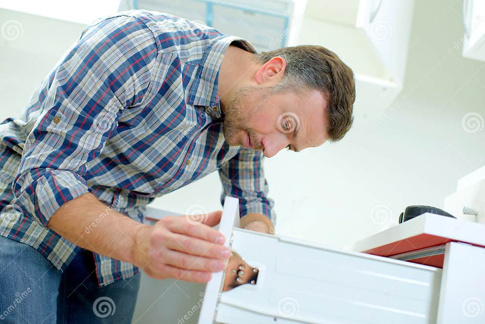 Builder Fitting Kitchen Draw Stock Photo - Image of handyman, pencil ...