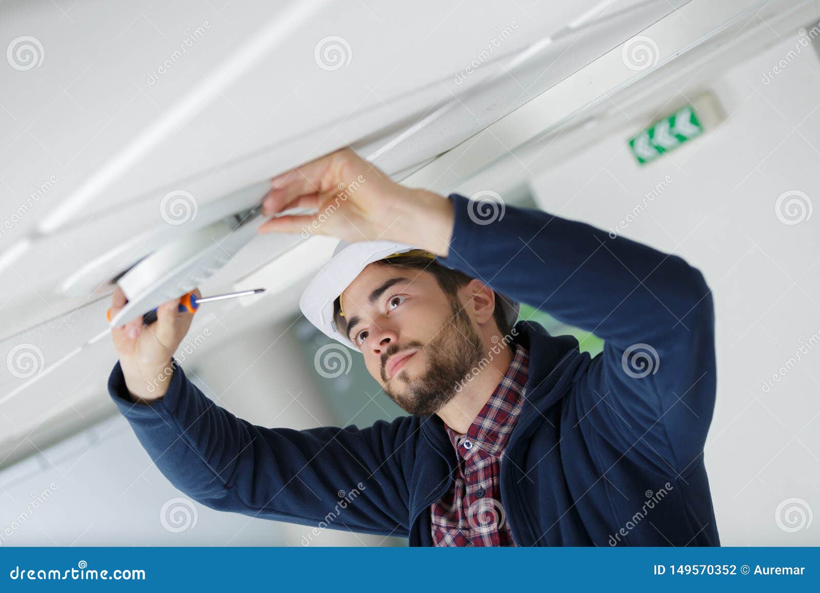 Builder Fixing Ceiling at Working Area Indoors Stock Photo - Image of ...