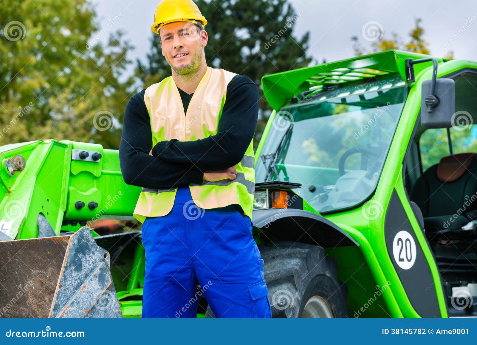 Builder in Front of Construction Machinery Stock Photo - Image of ...