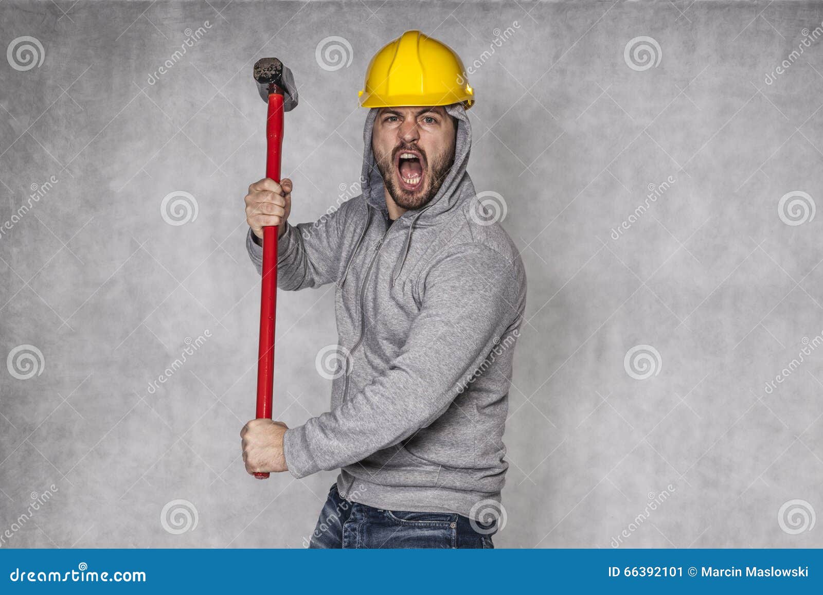 Builder on a Grey Background, Holding a Hammer and Shouting Stock Image ...