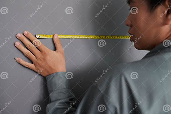 Builder Measuring Wall stock image. Image of room, measuring - 285857045