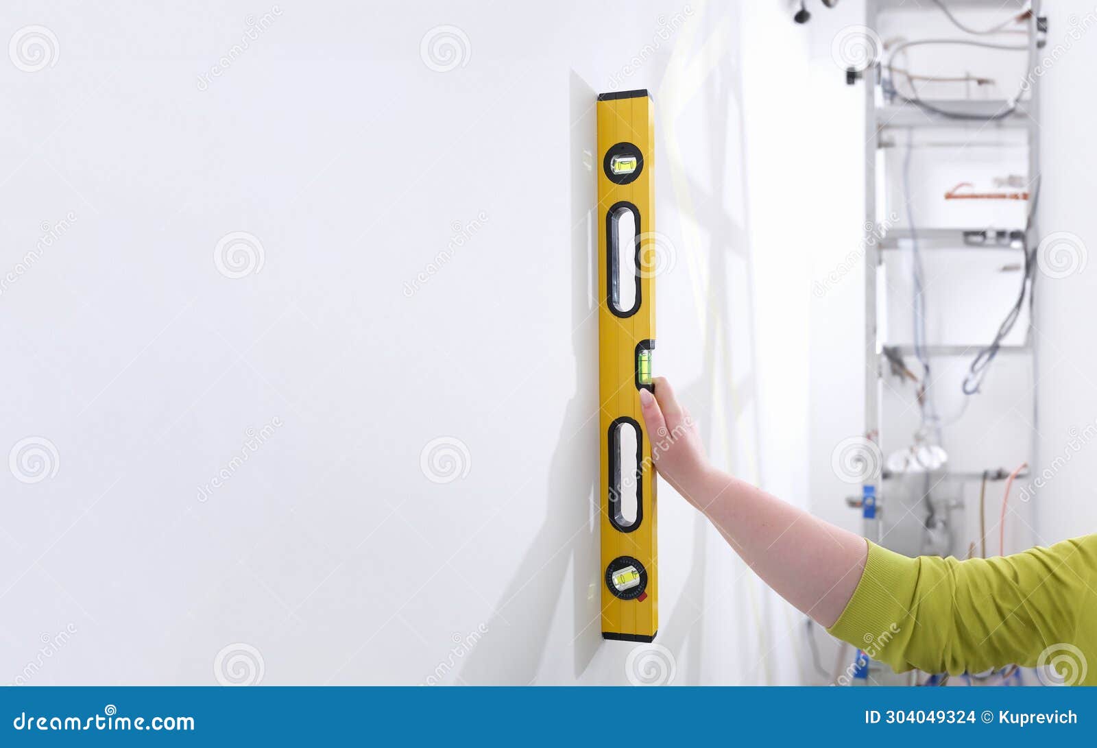 Builder Hand with Building Level Measures Wall Stock Photo - Image of ...