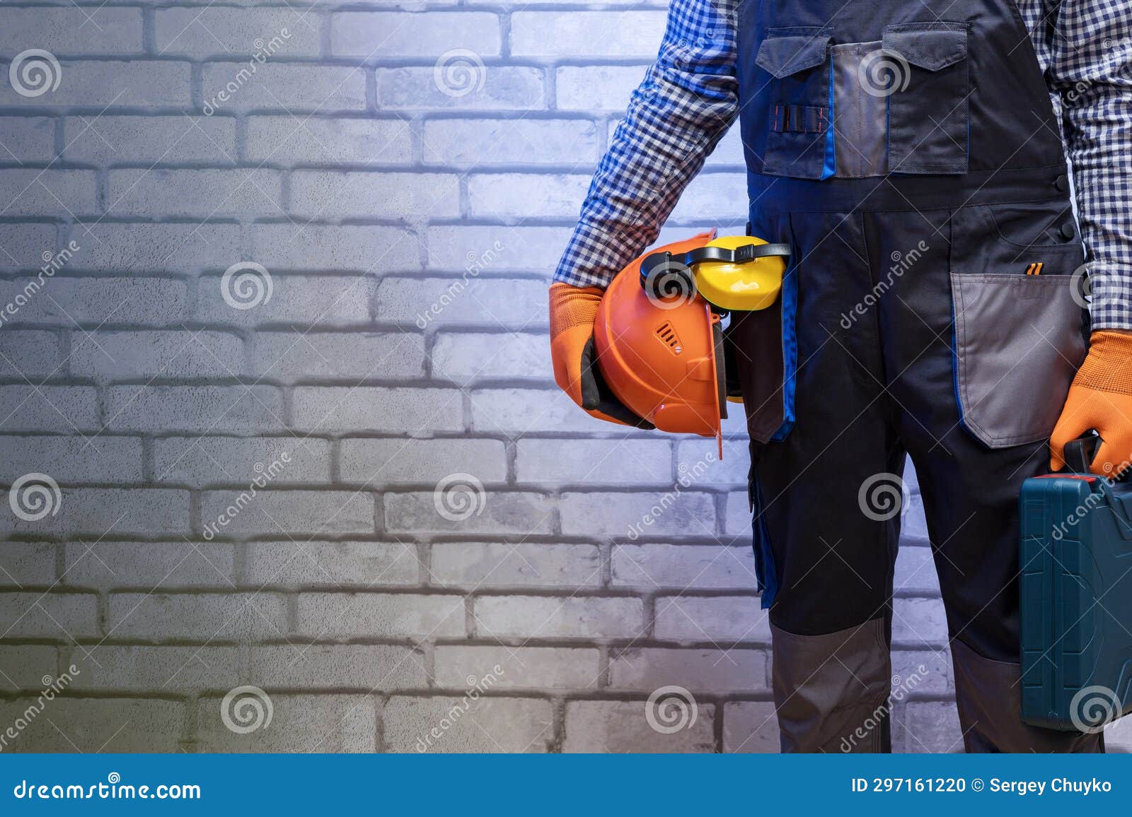Builder Handyman with Construction Tools Against Wall Background Stock ...
