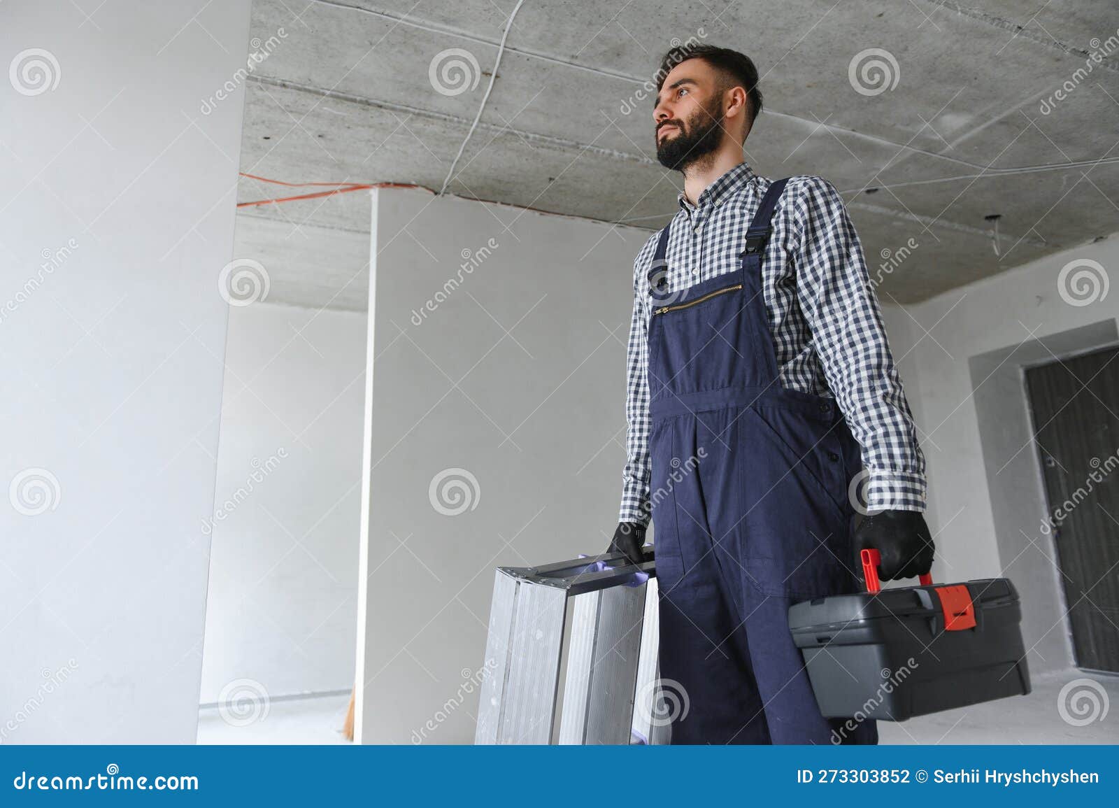 Builder Handyman with Construction Tools. House Renovation Background ...