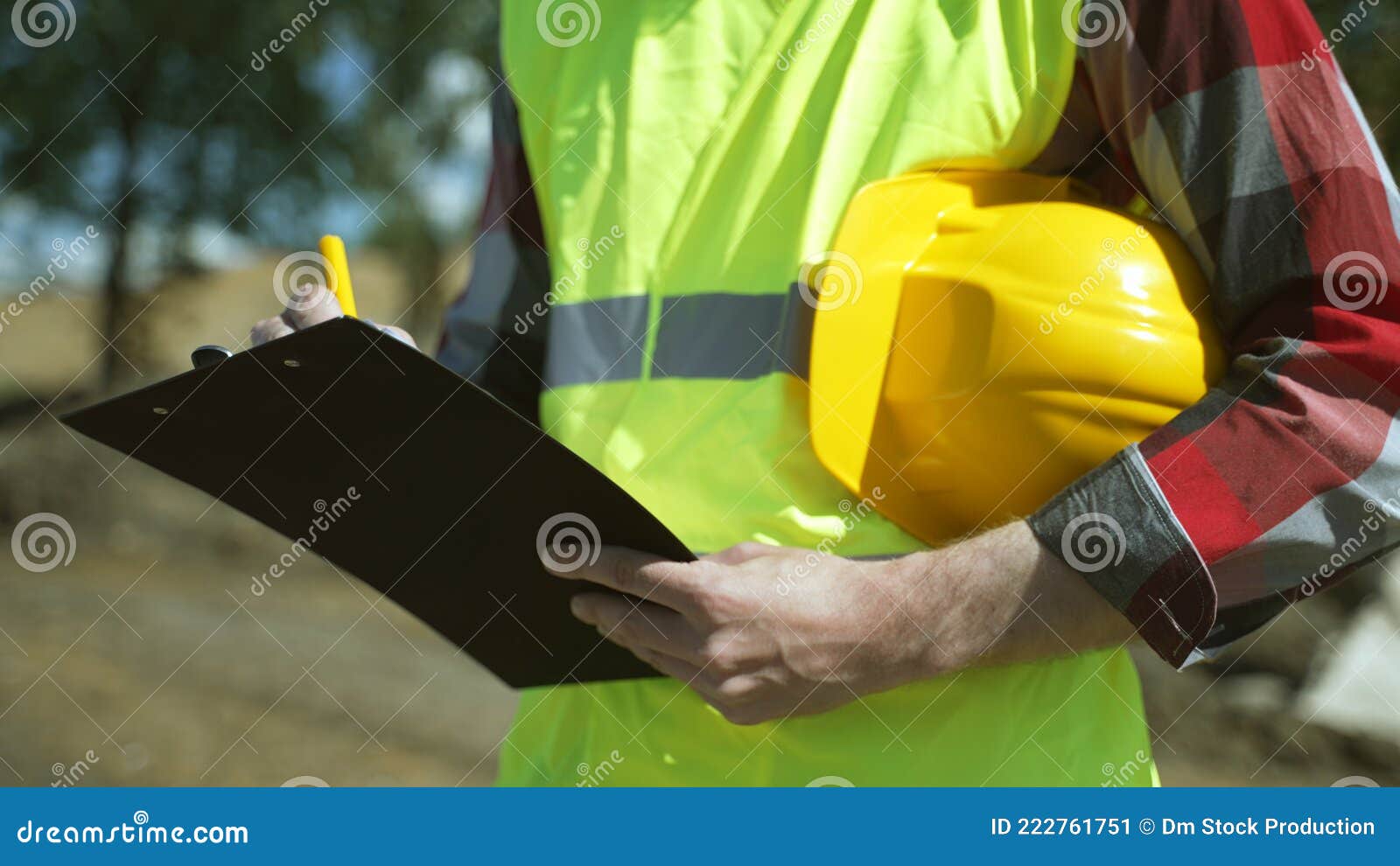 Builder with Hard Hat Inspects Construction Site. Stock Image - Image ...