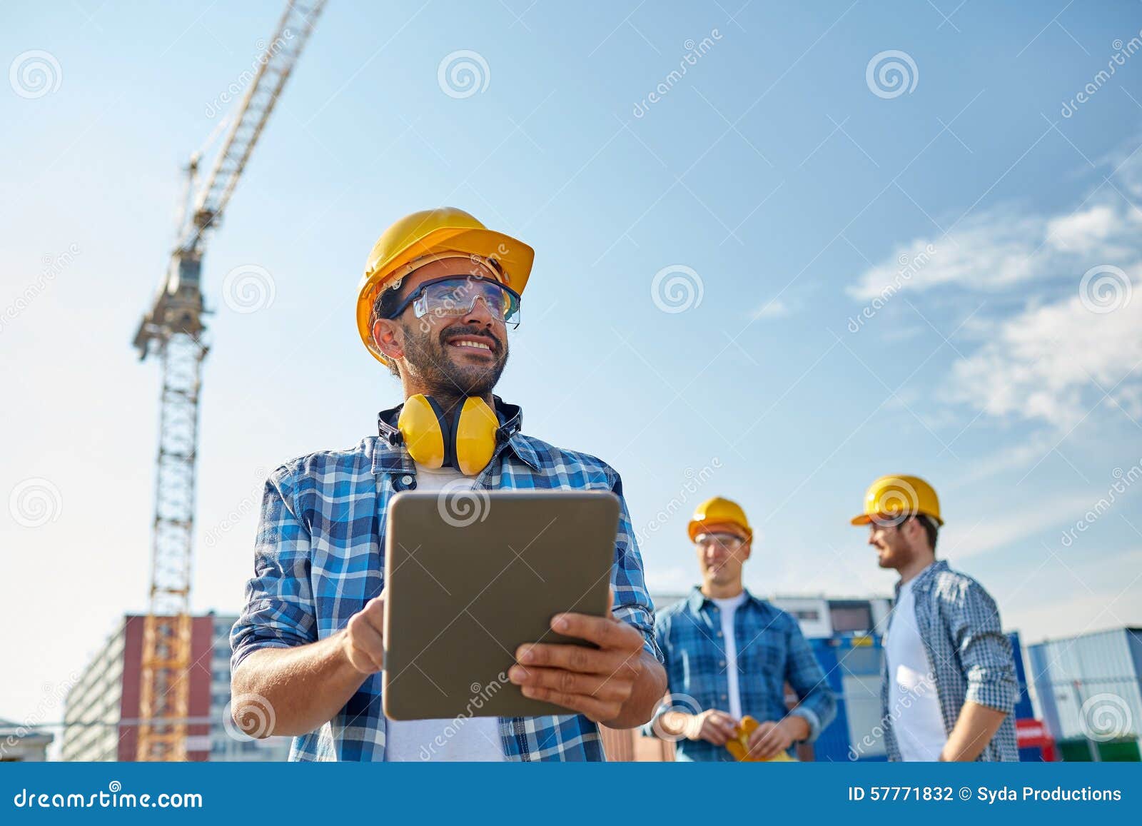 Builder in Hardhat with Tablet Pc at Construction Stock Photo - Image ...