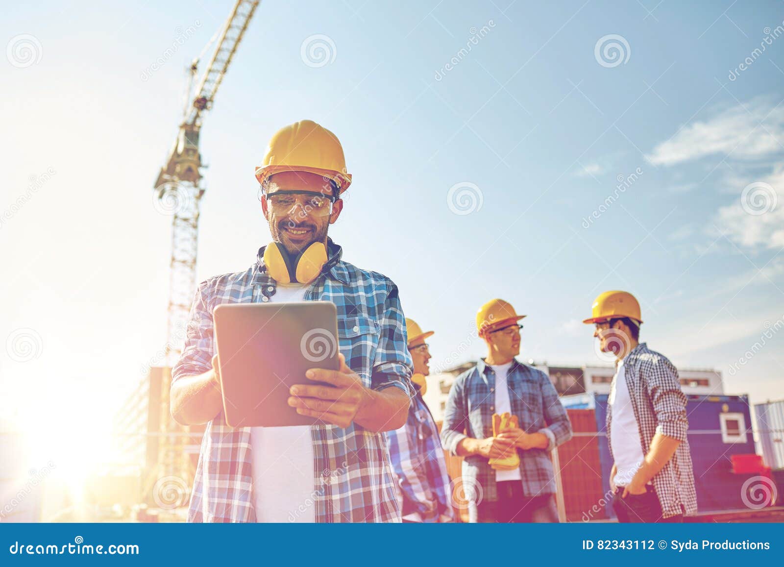 Builder in Hardhat with Tablet Pc at Construction Stock Photo - Image ...