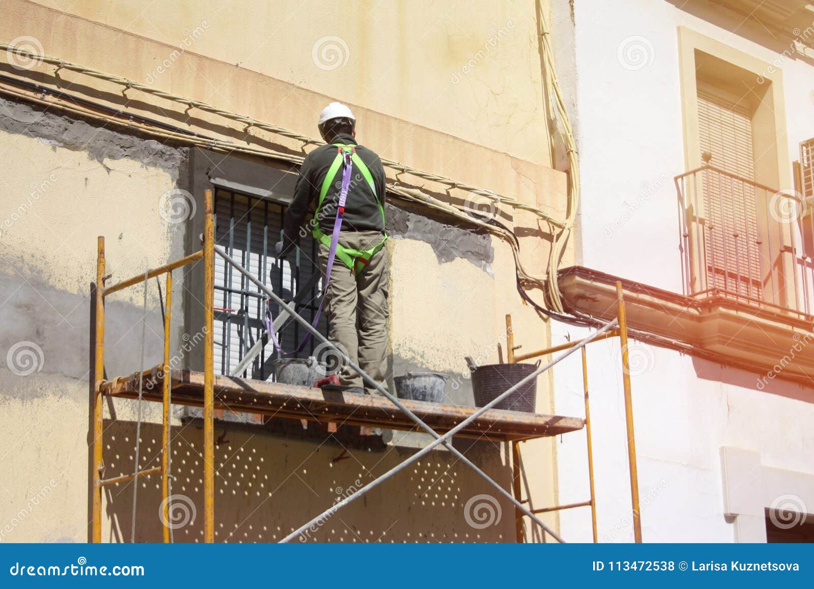 Builder at the Height Repair the Facade Stock Photo - Image of exterior ...