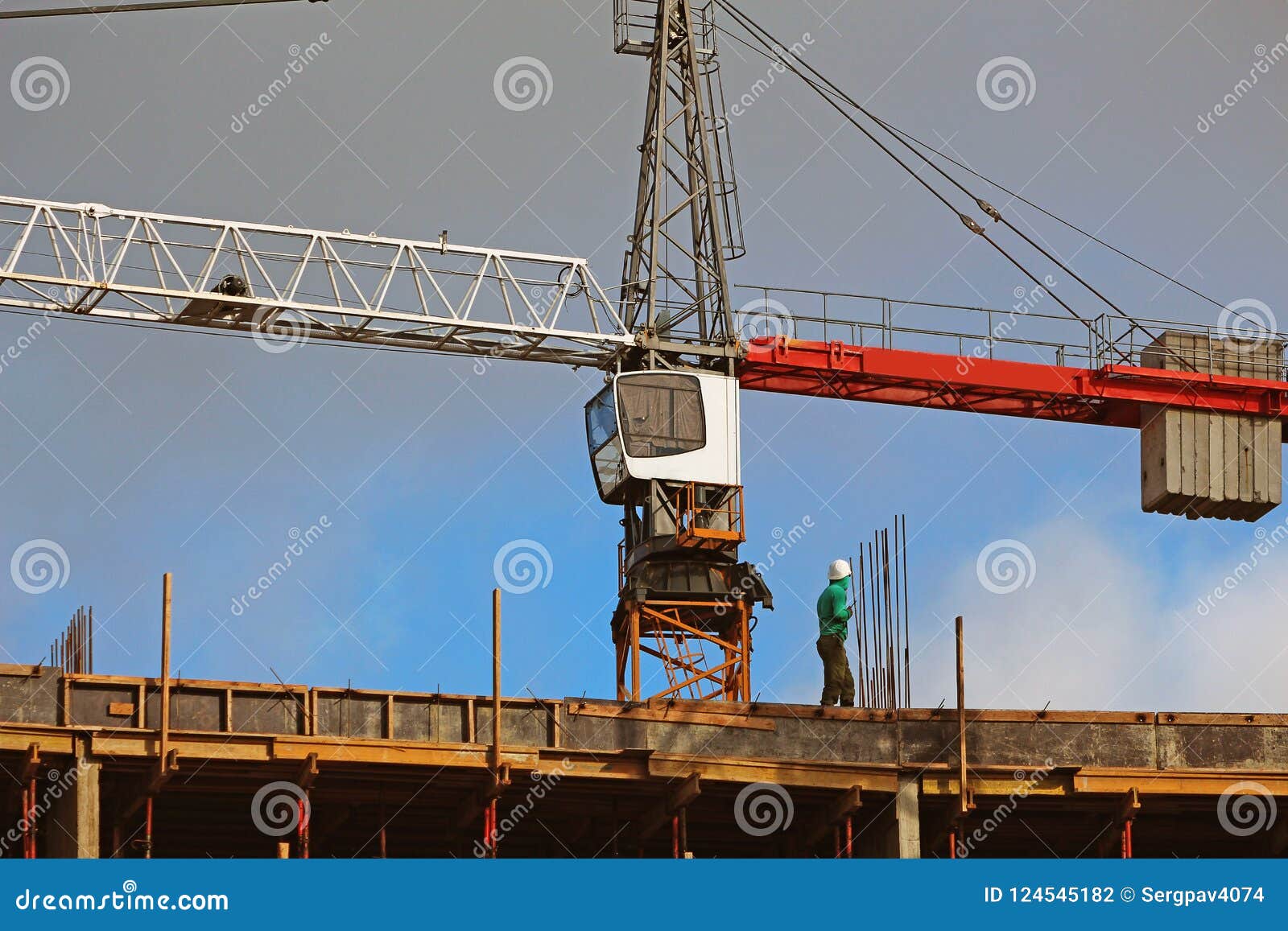 Builder in a Helmet on the Construction Site Stock Photo - Image of ...