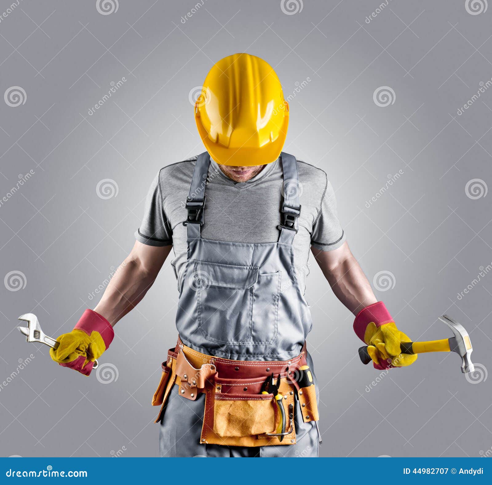 Builder in a Helmet with a Hammer and a Wrench Stock Image - Image of ...