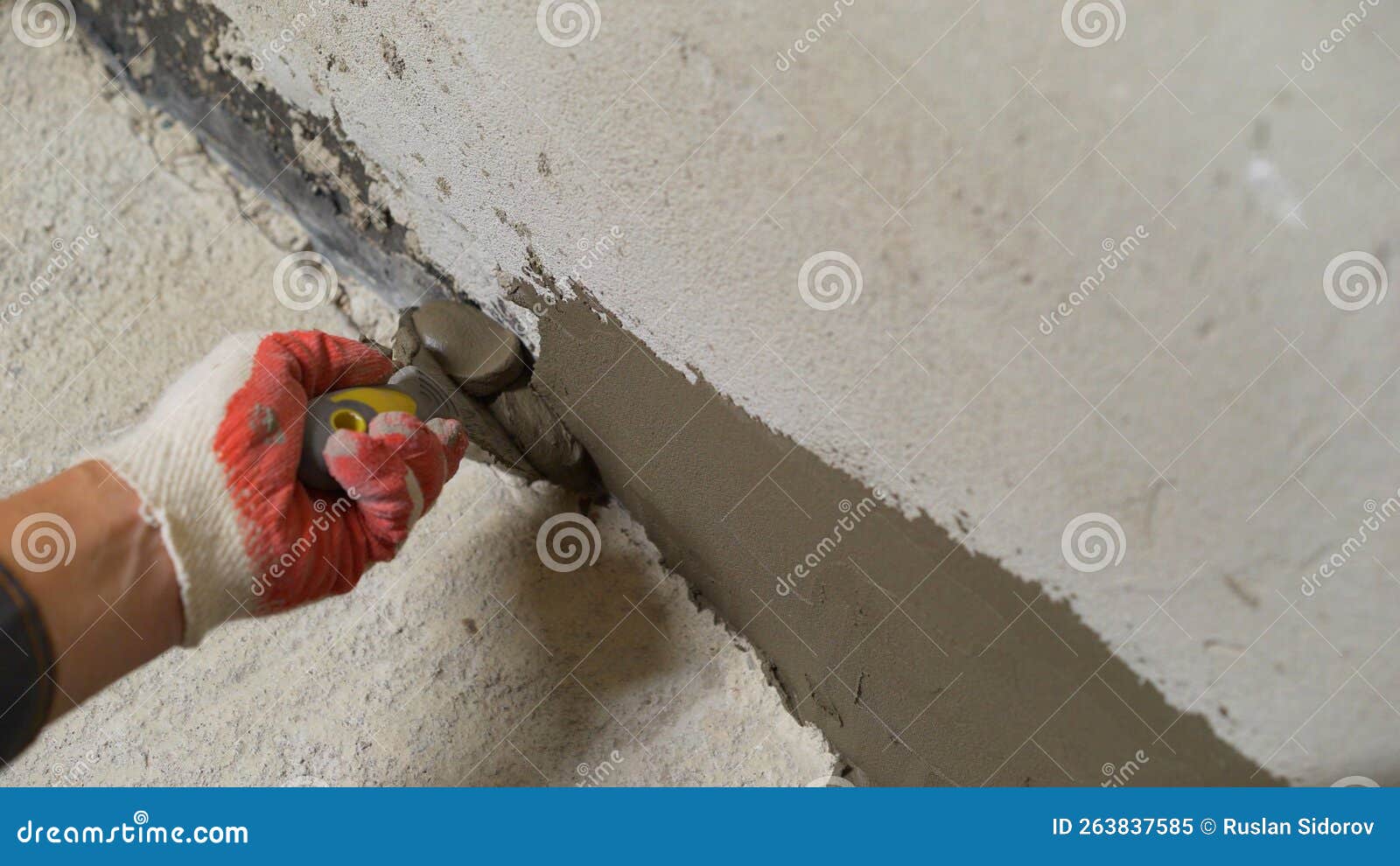 The Builder with the Help of a Solution Removes Irregularities on the ...