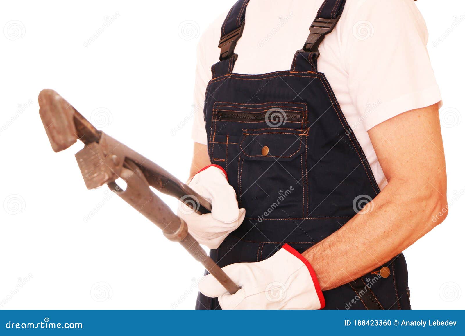 The Builder is Holding a Large Adjustable Spanner in His Hands. the ...