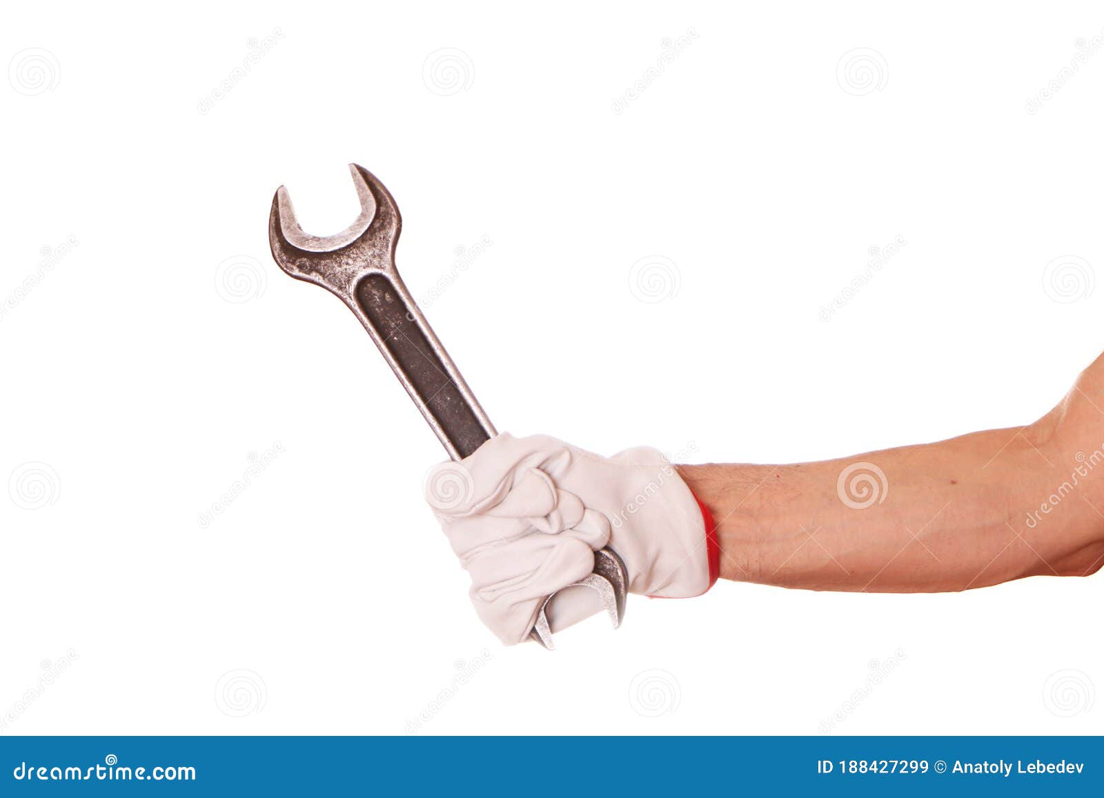 The Builder is Holding a Large Adjustable Spanner in His Hands. the ...