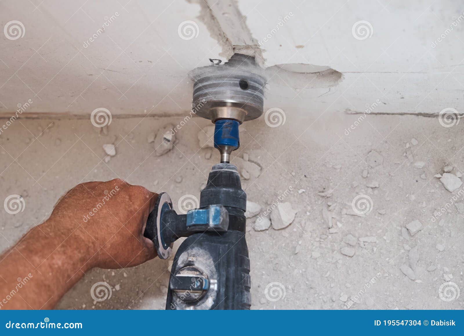 Builder with Hummer Drill Perforator Drills Hole in a Wall Stock Photo ...