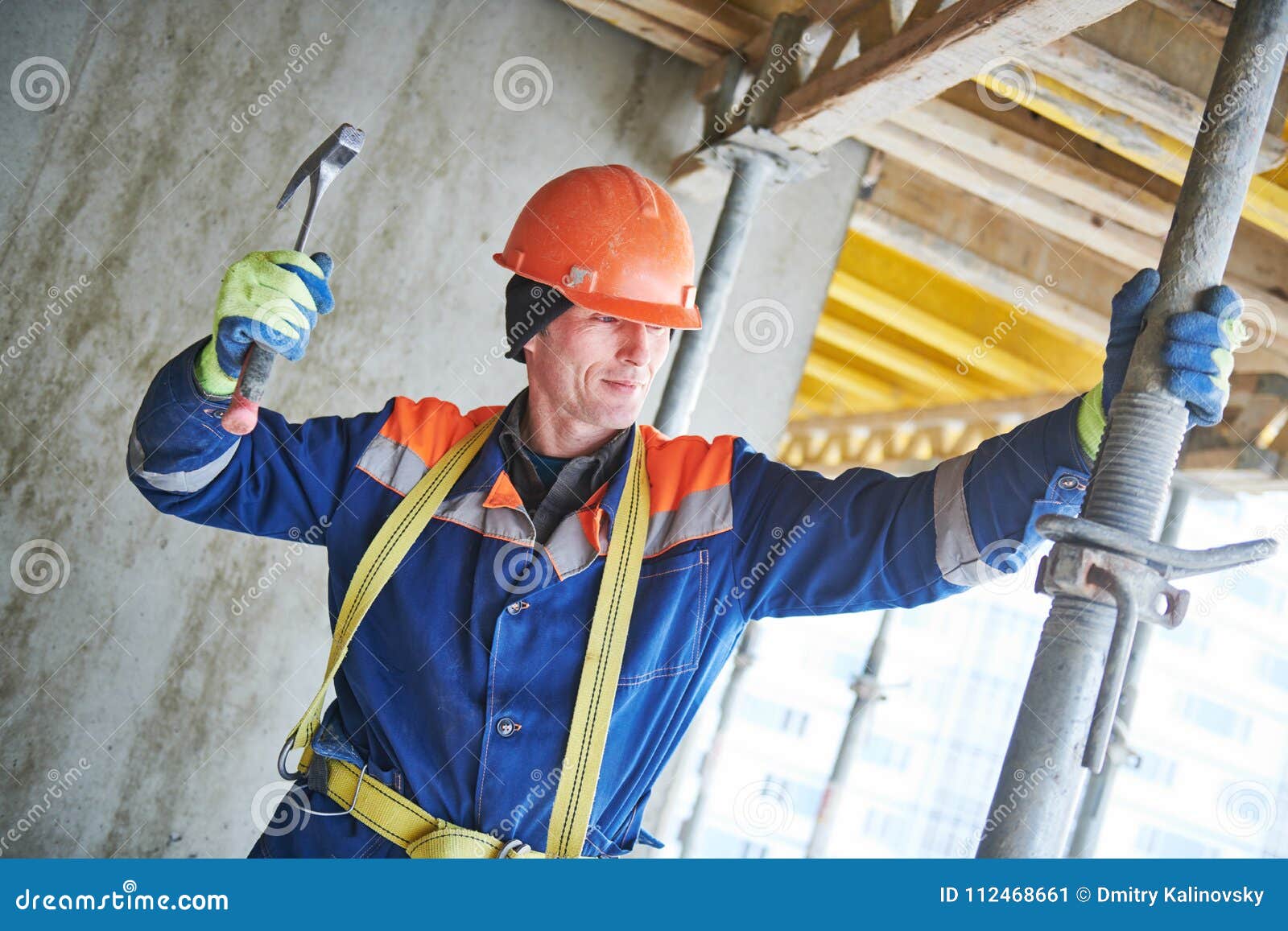 Builder Installing Or Dismantling Pole Support For Concrete Monolithic ...
