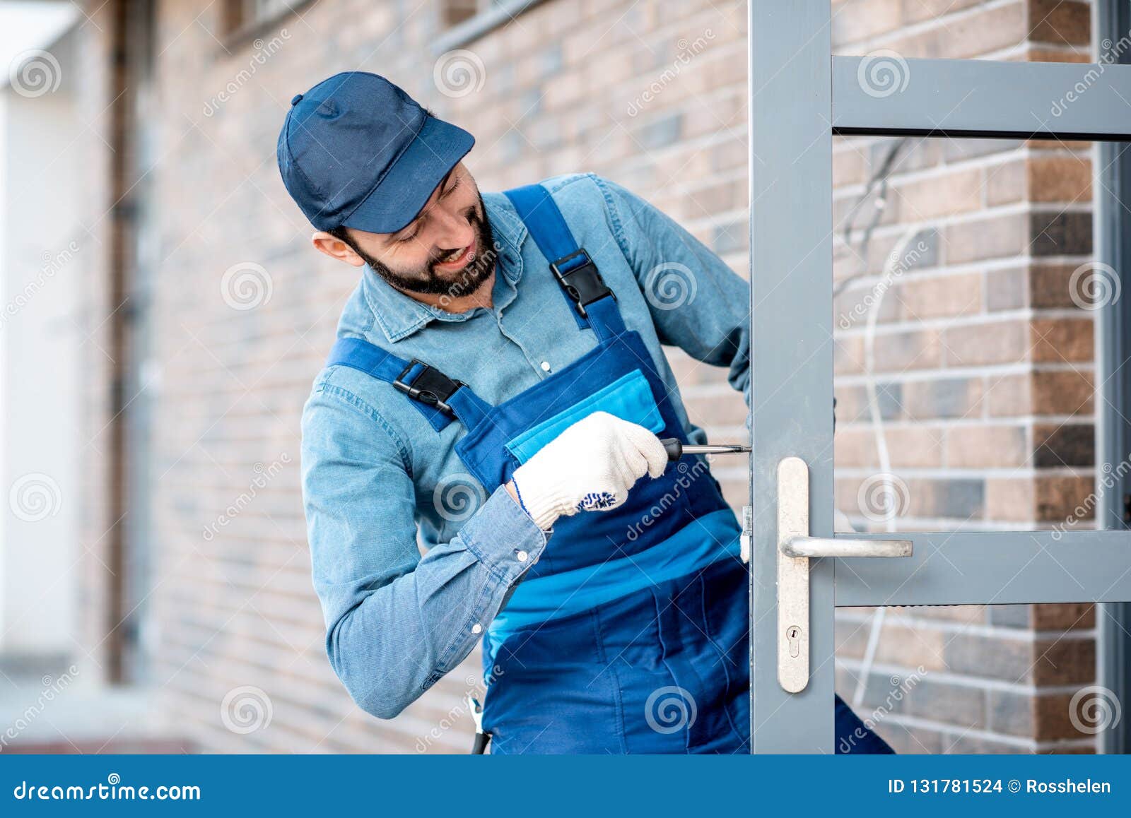 Builder Installing Door Lock Stock Photo - Image of repair, worker ...