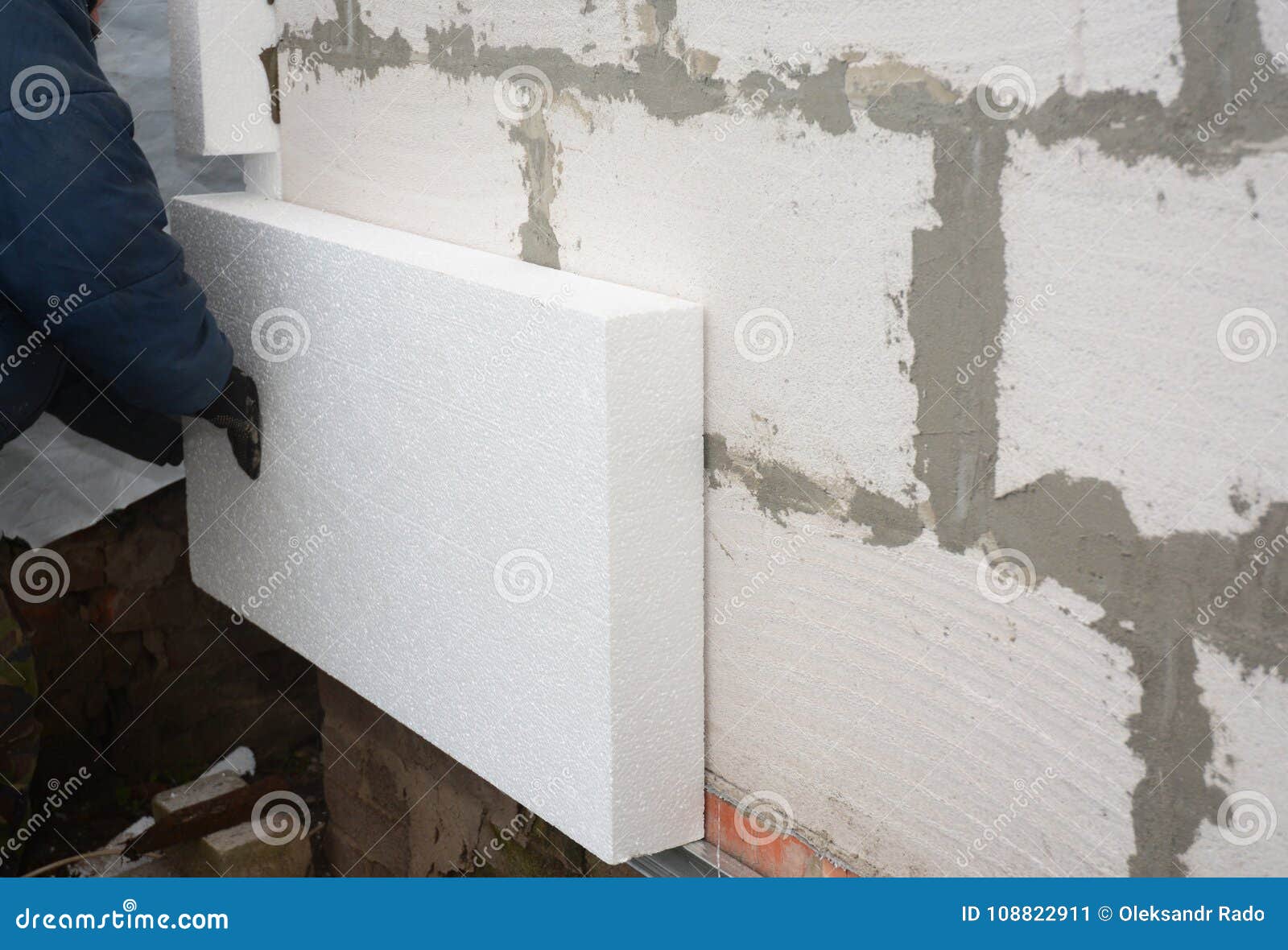 Builder Installing Rigid Styrofoam Insulation Board for Energy Saving ...