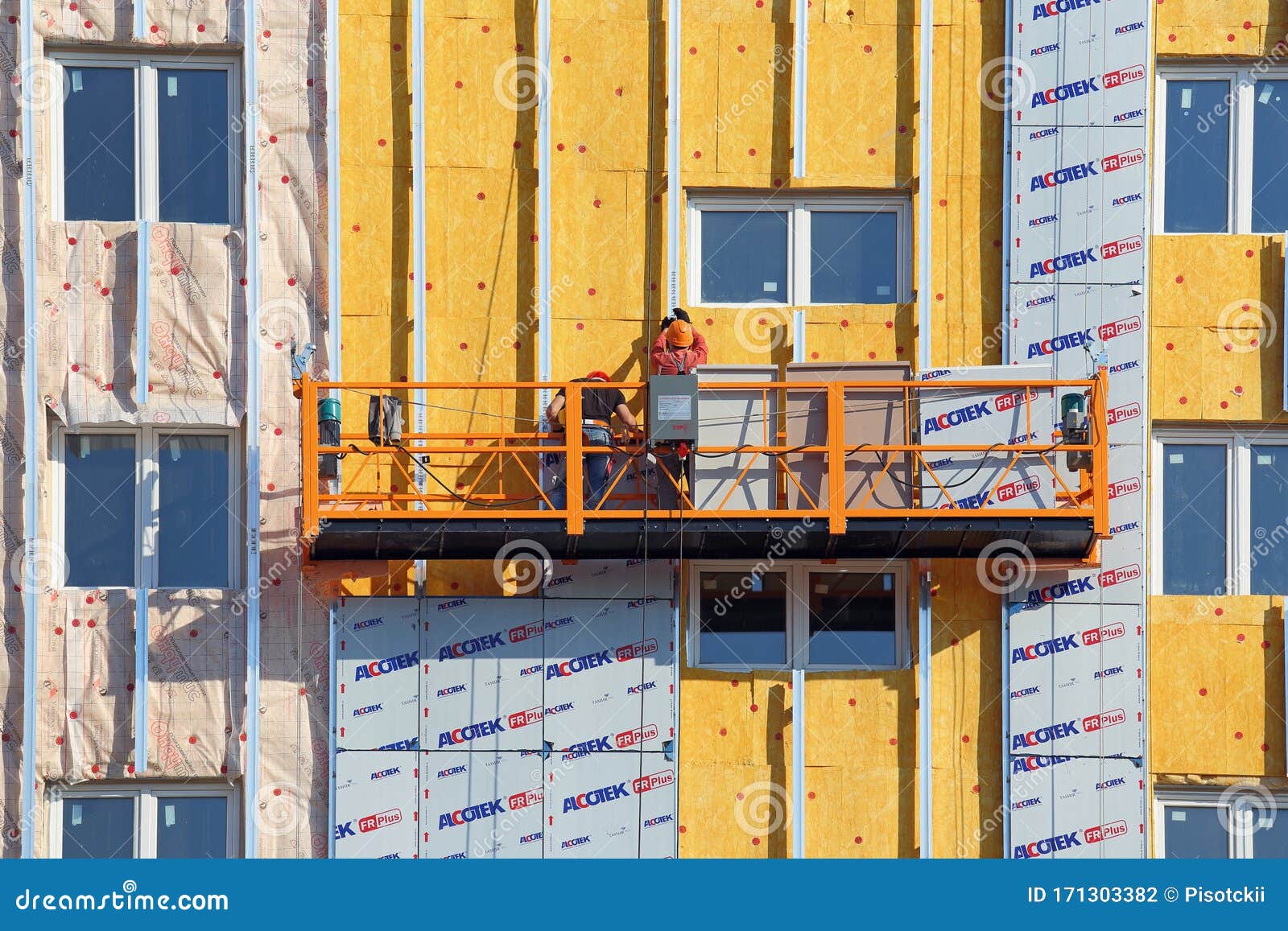 The Builder Installs and Closes the Thermal Insulation Panels on the ...