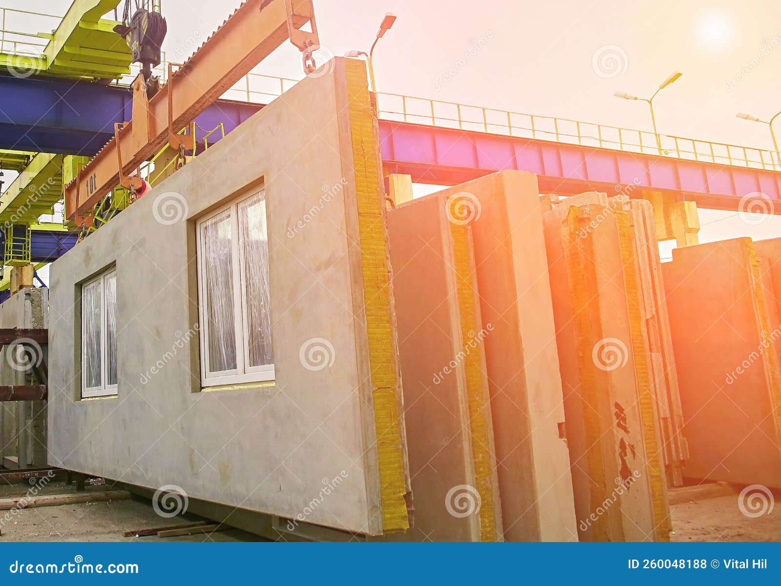 A Builder Installs a Concrete Floor Slab Panel at a Construction Site ...