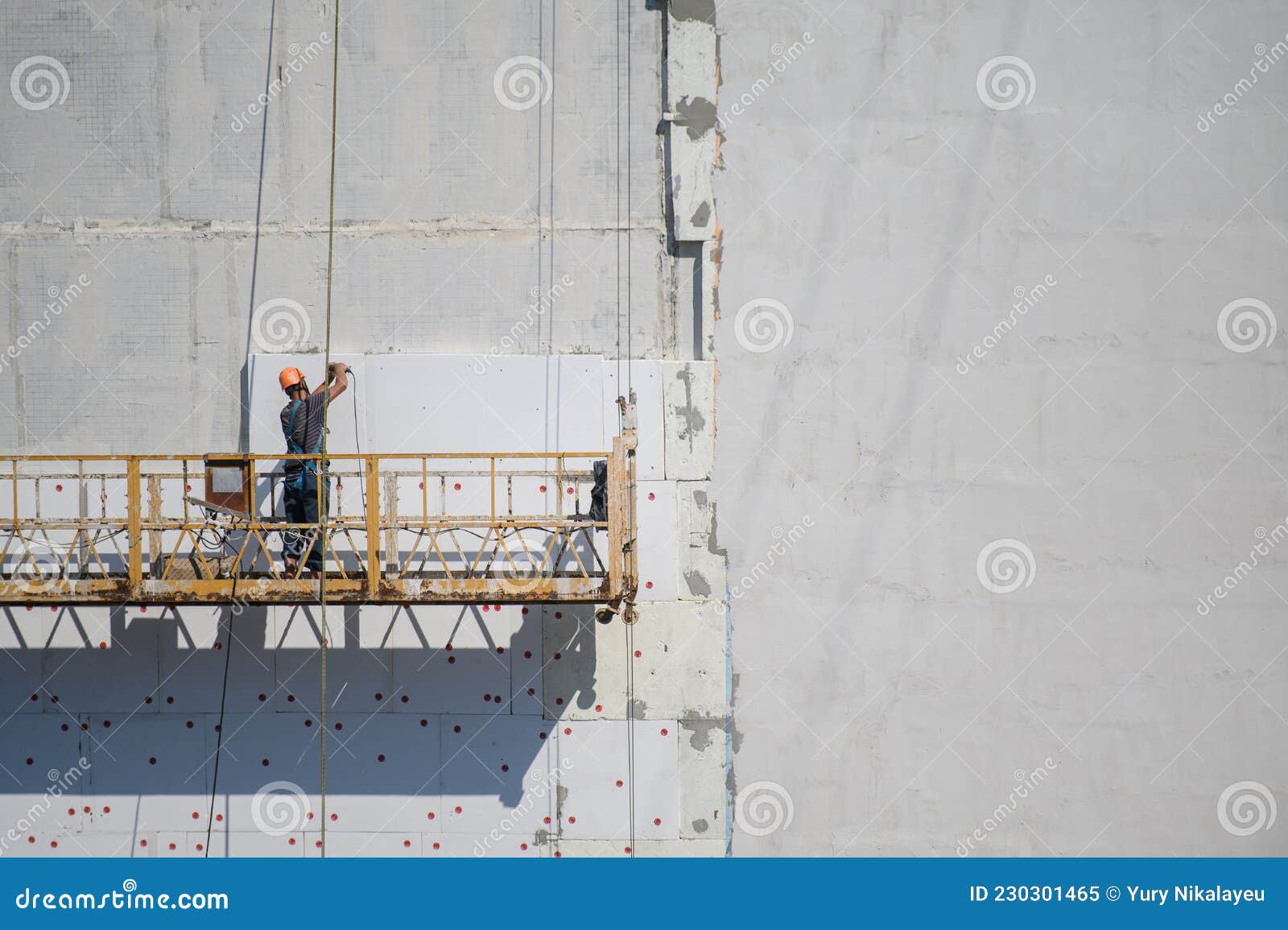 The Builder Insulates the House from the Outside.Construction Elevator ...