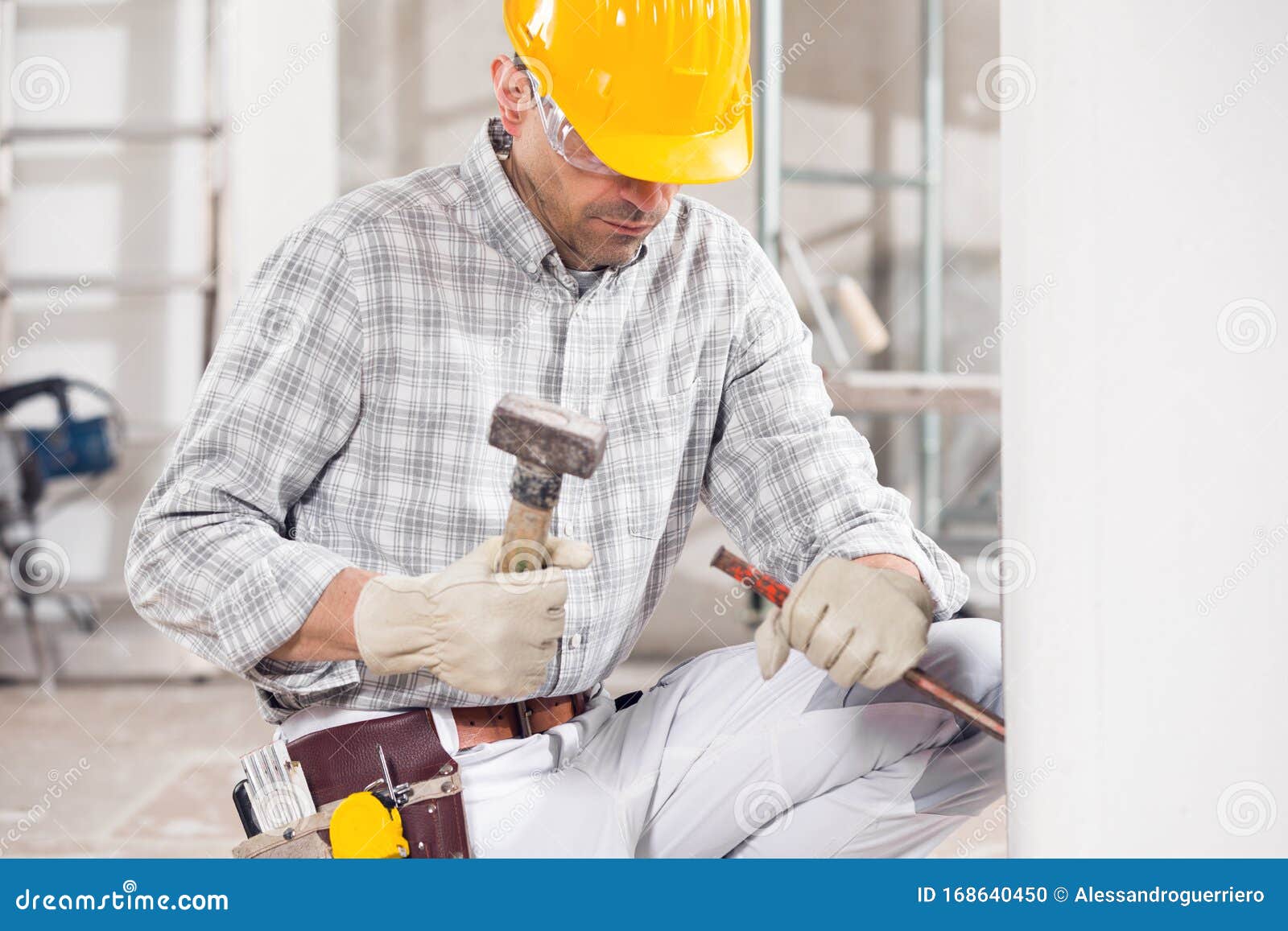 Builder Kneeling Using a Chisel and Mallet Stock Photo - Image of ...