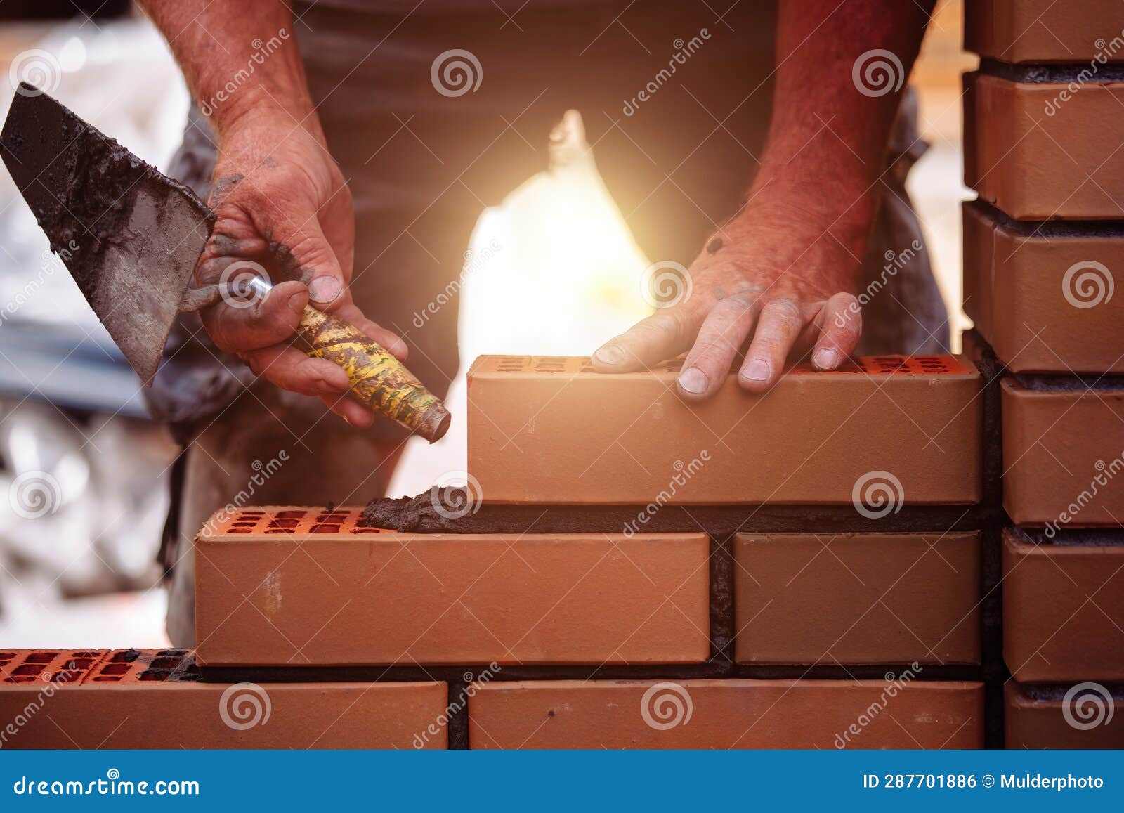 Builder Laying Bricks on Construction Site Stock Photo - Image of ...