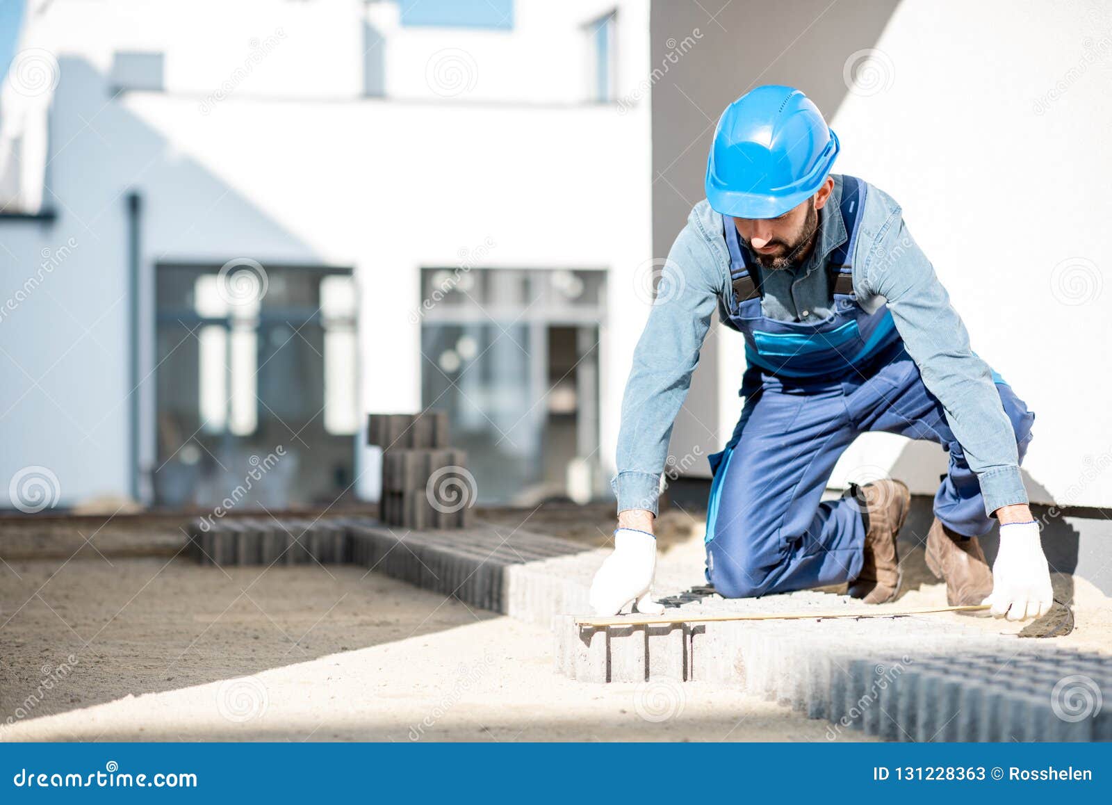 Builder Laying Paving Tiles Stock Image - Image of construction ...