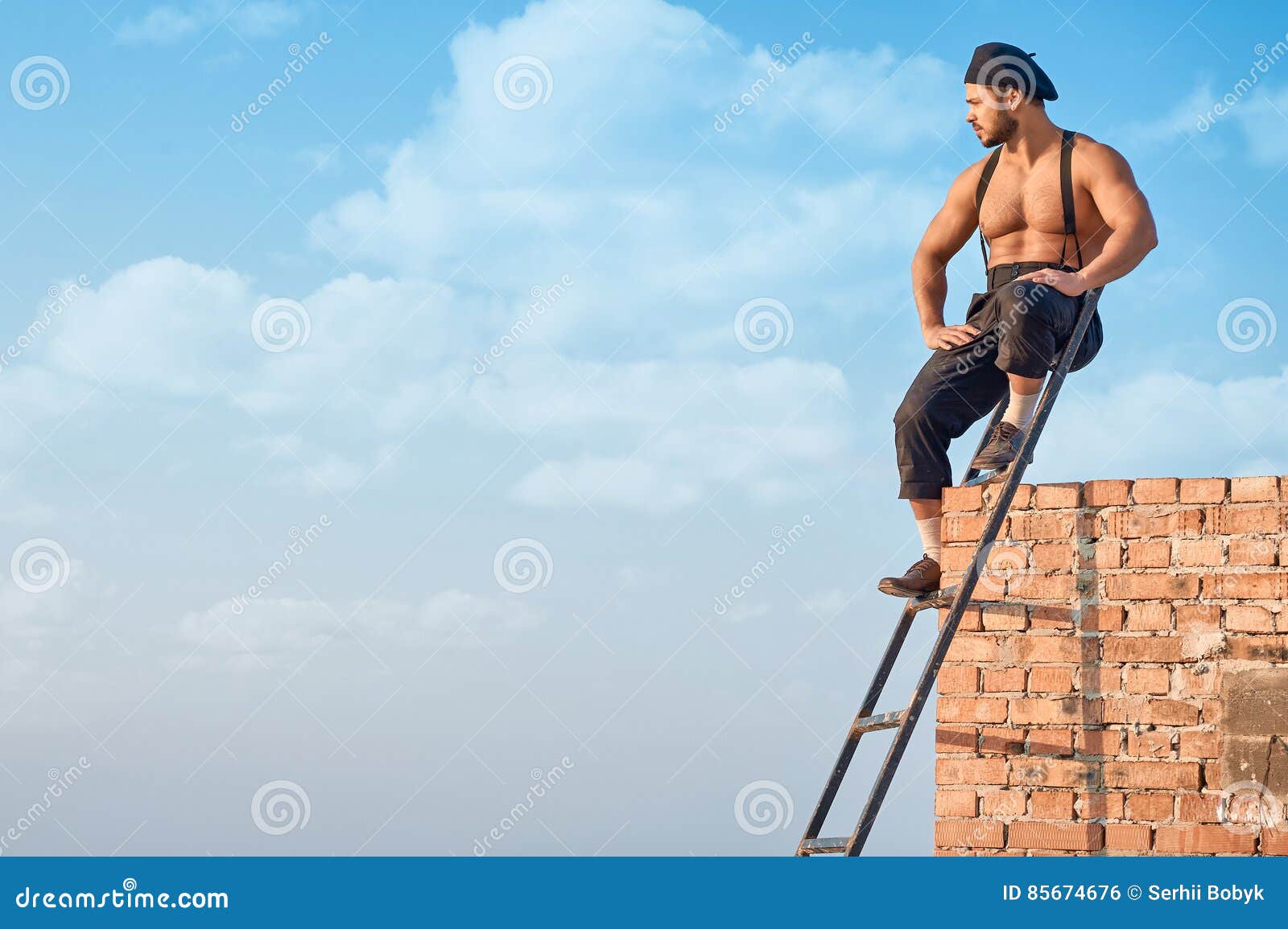 Builder Leaning on Brick Wall on High. Stock Photo - Image of male ...