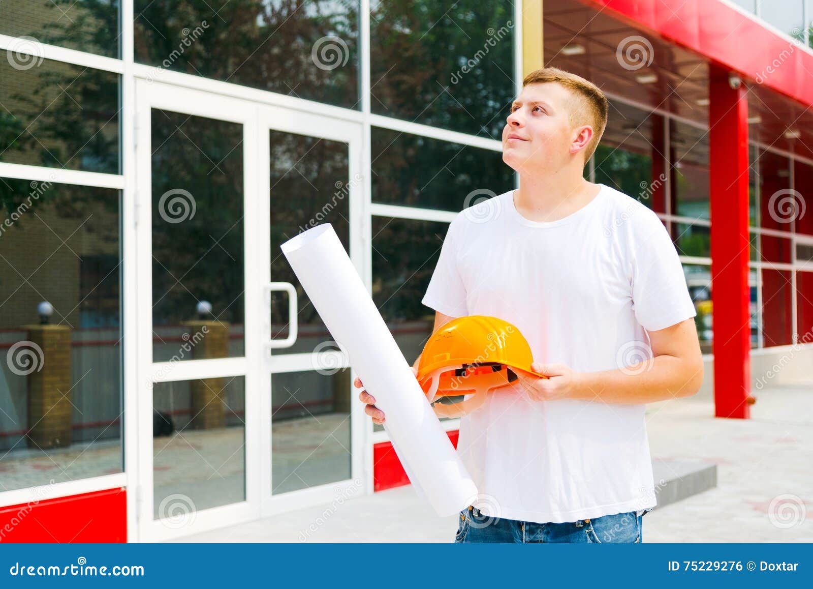 Builder Looking at a Building with a Smile Stock Photo - Image of ...