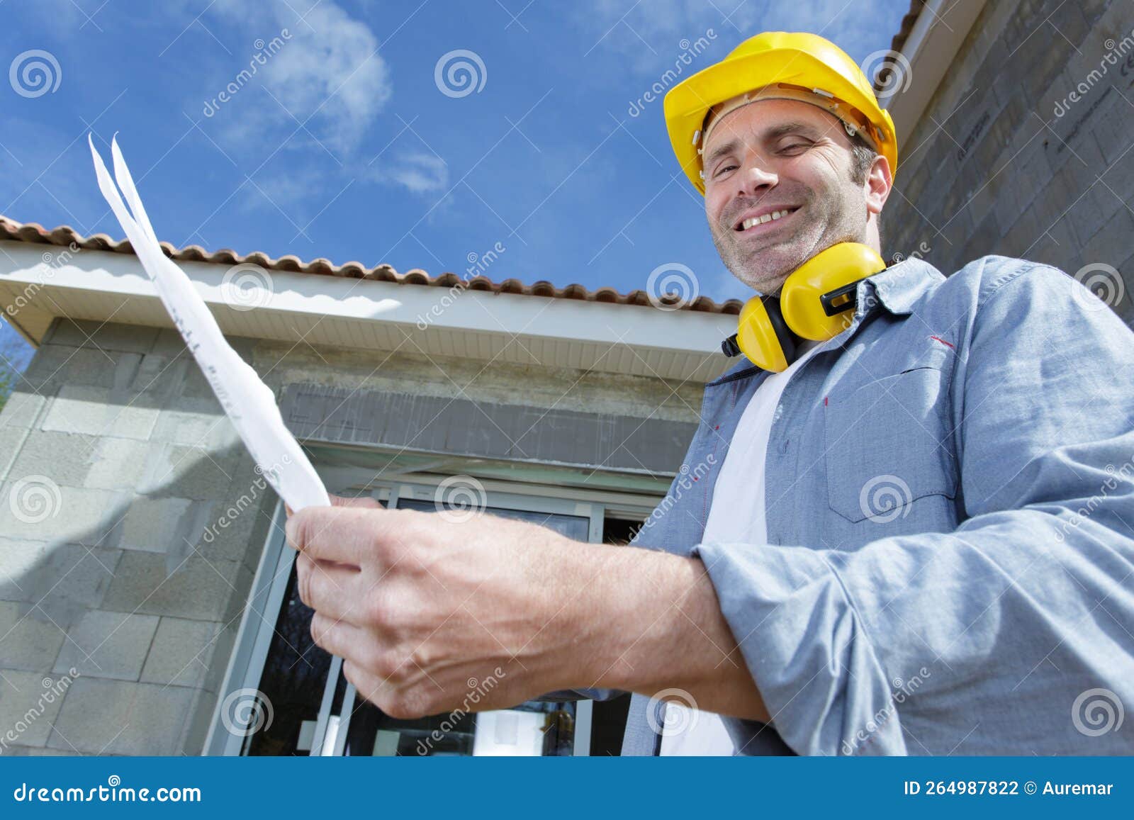 Builder Looking at Plan Outdoors Stock Photo - Image of happy ...