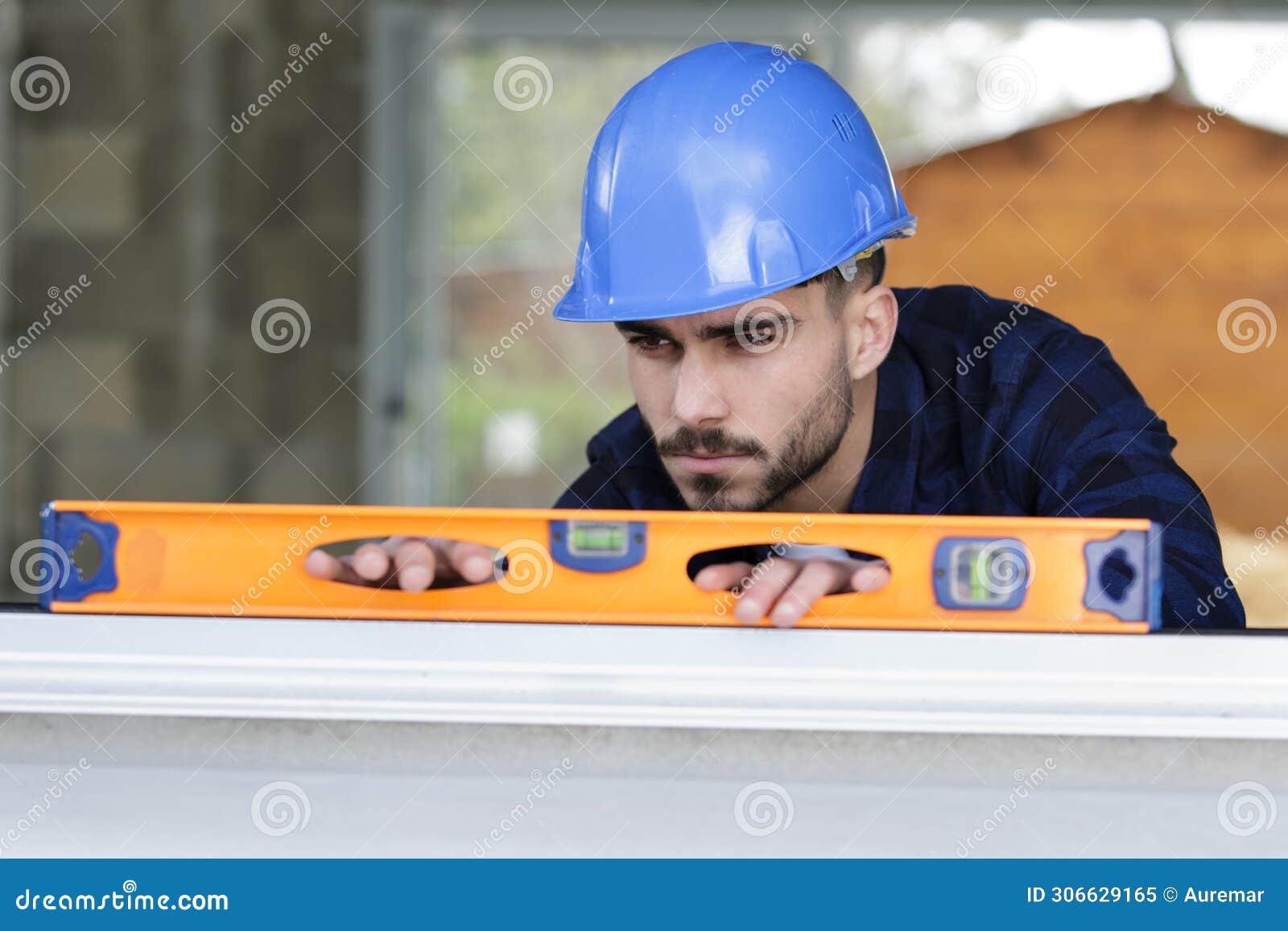 Builder Looks at Construction Level Checks Horizontal Surface Stock ...