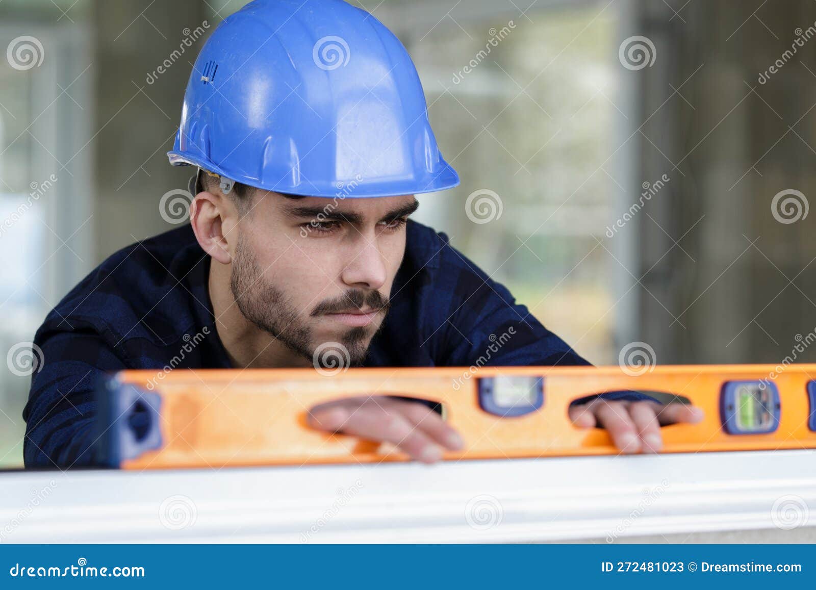 Builder Looks at Construction Level Checks Horizontal Surface Stock ...