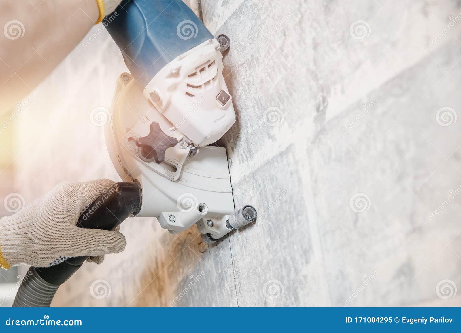 Builder Man Cutting Electrical Chase in Concrete Wall with Circulation ...