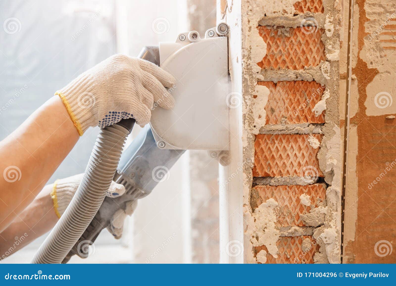 Builder Man Cutting Electrical Chase in Concrete Wall with Circulation ...