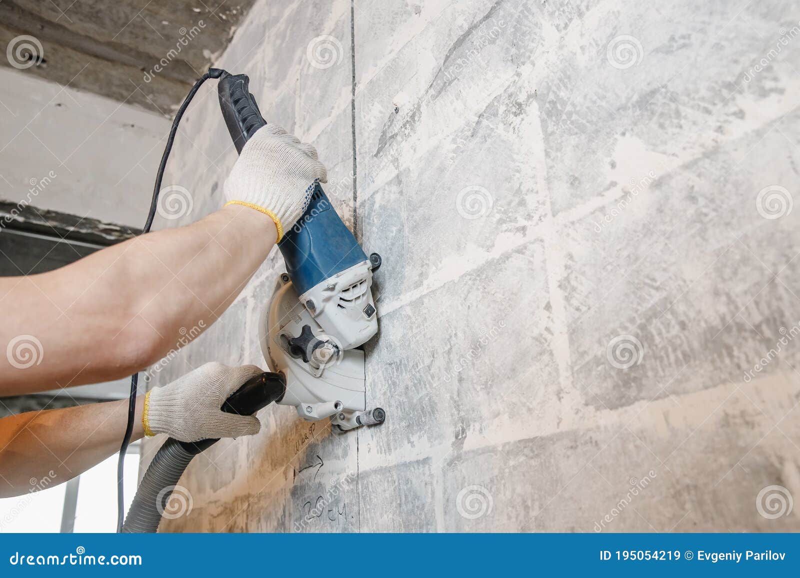 Builder Man Cutting Electrical Chase in Concrete Wall with Circulation ...