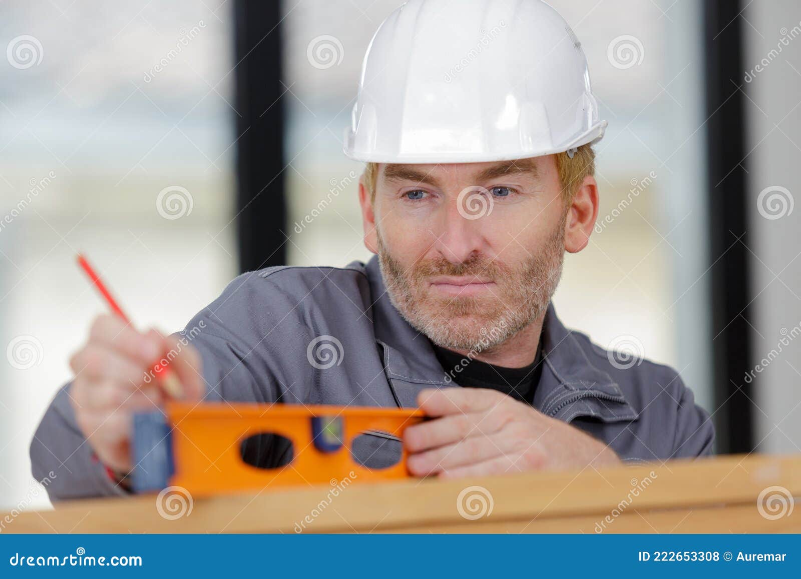 Builder man with level stock photo. Image of mason, equipment - 222653308