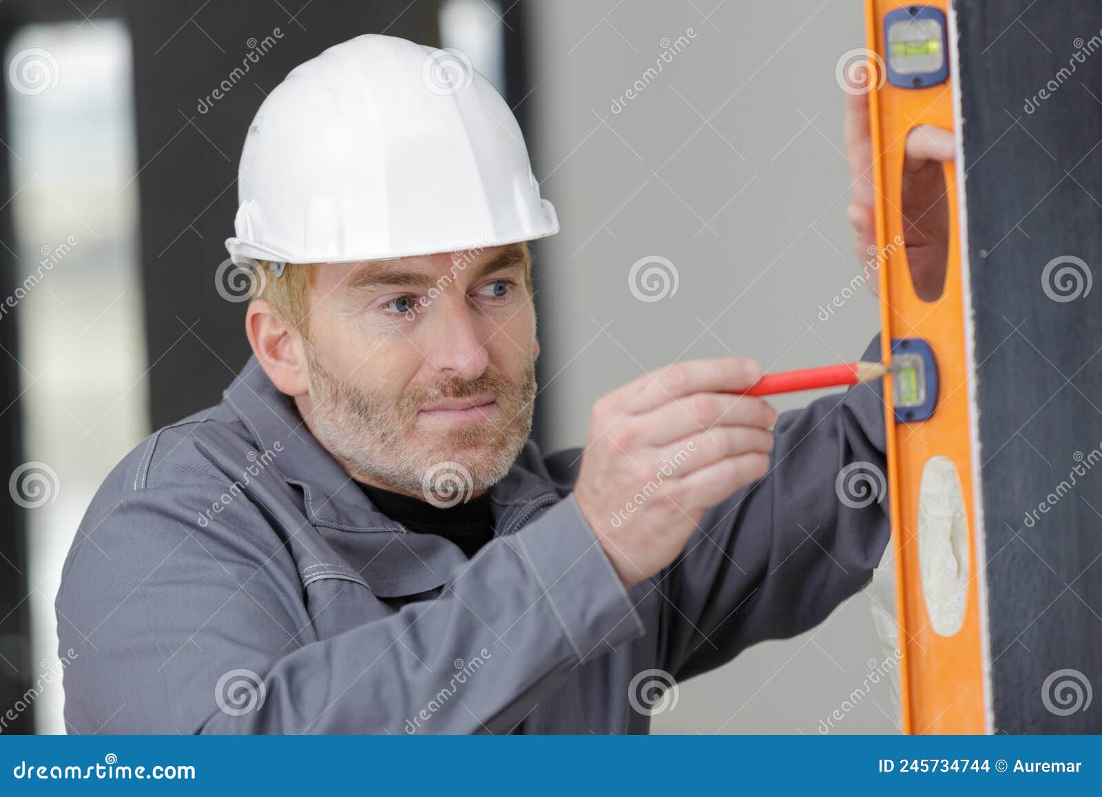 Builder man with level stock photo. Image of repairman - 245734744